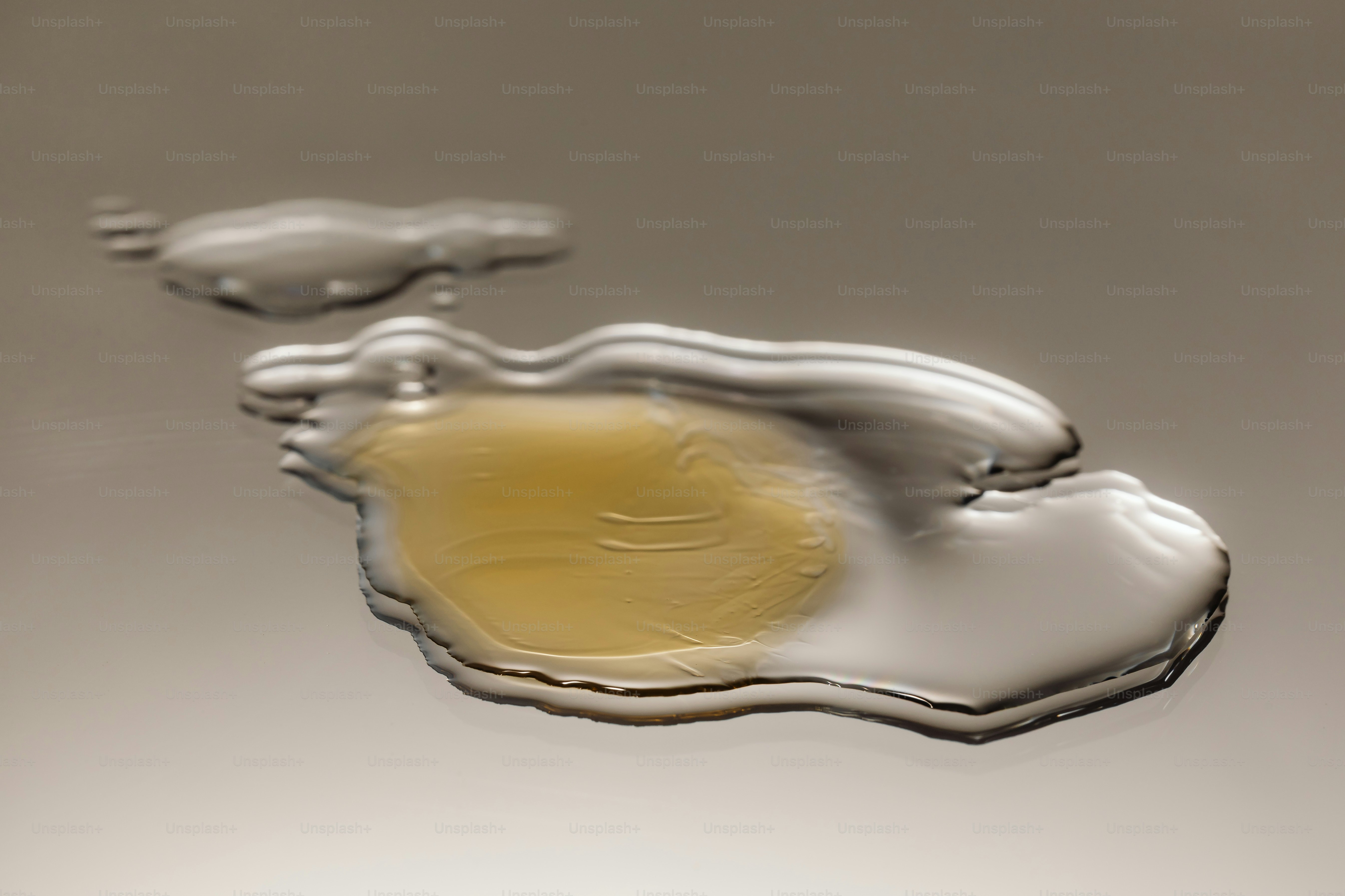 Two blobs of liquid on a neutral surface photo – Macro Image on Unsplash