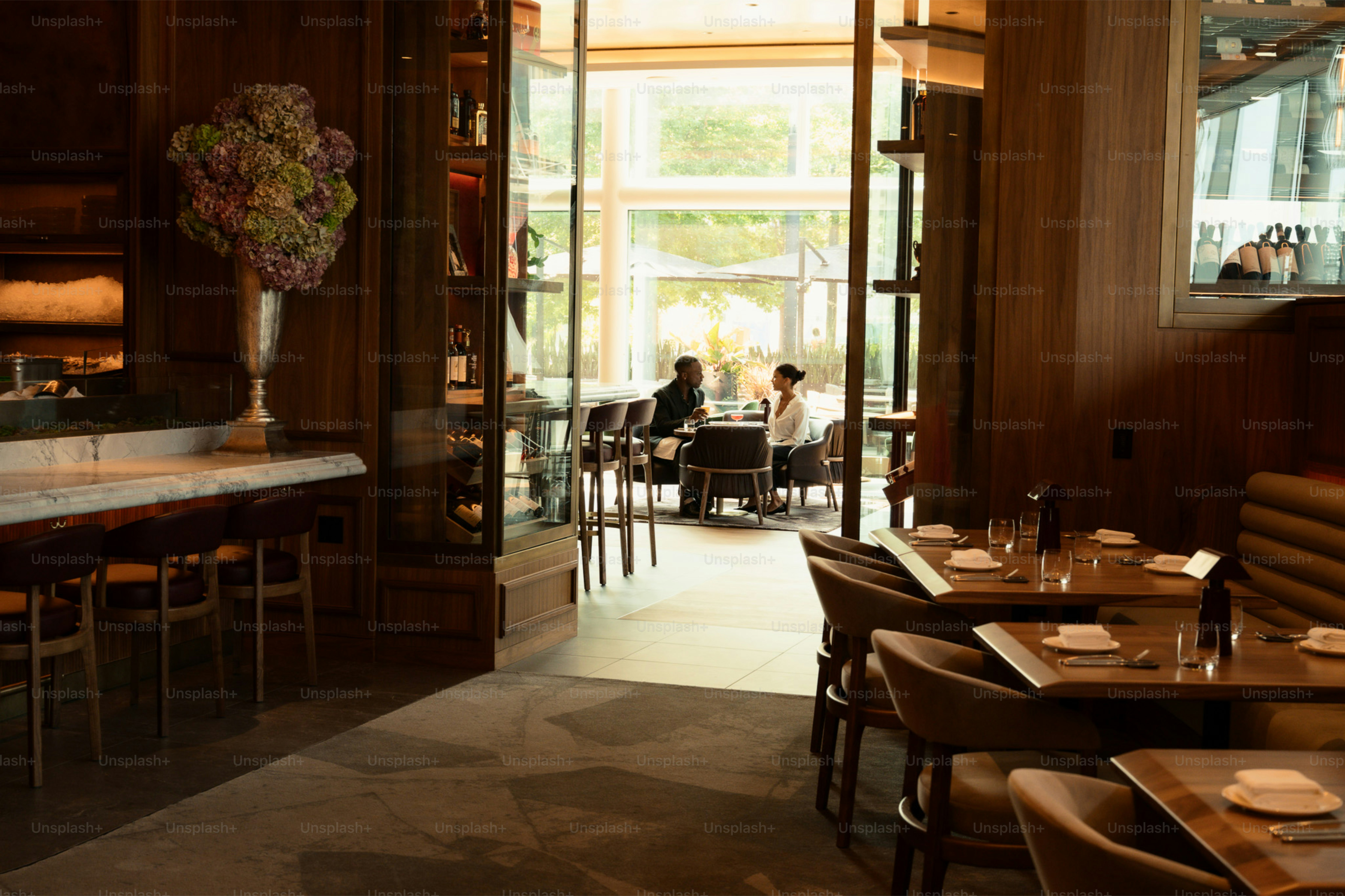 Elegant restaurant interior with dining tables and people. photo ...