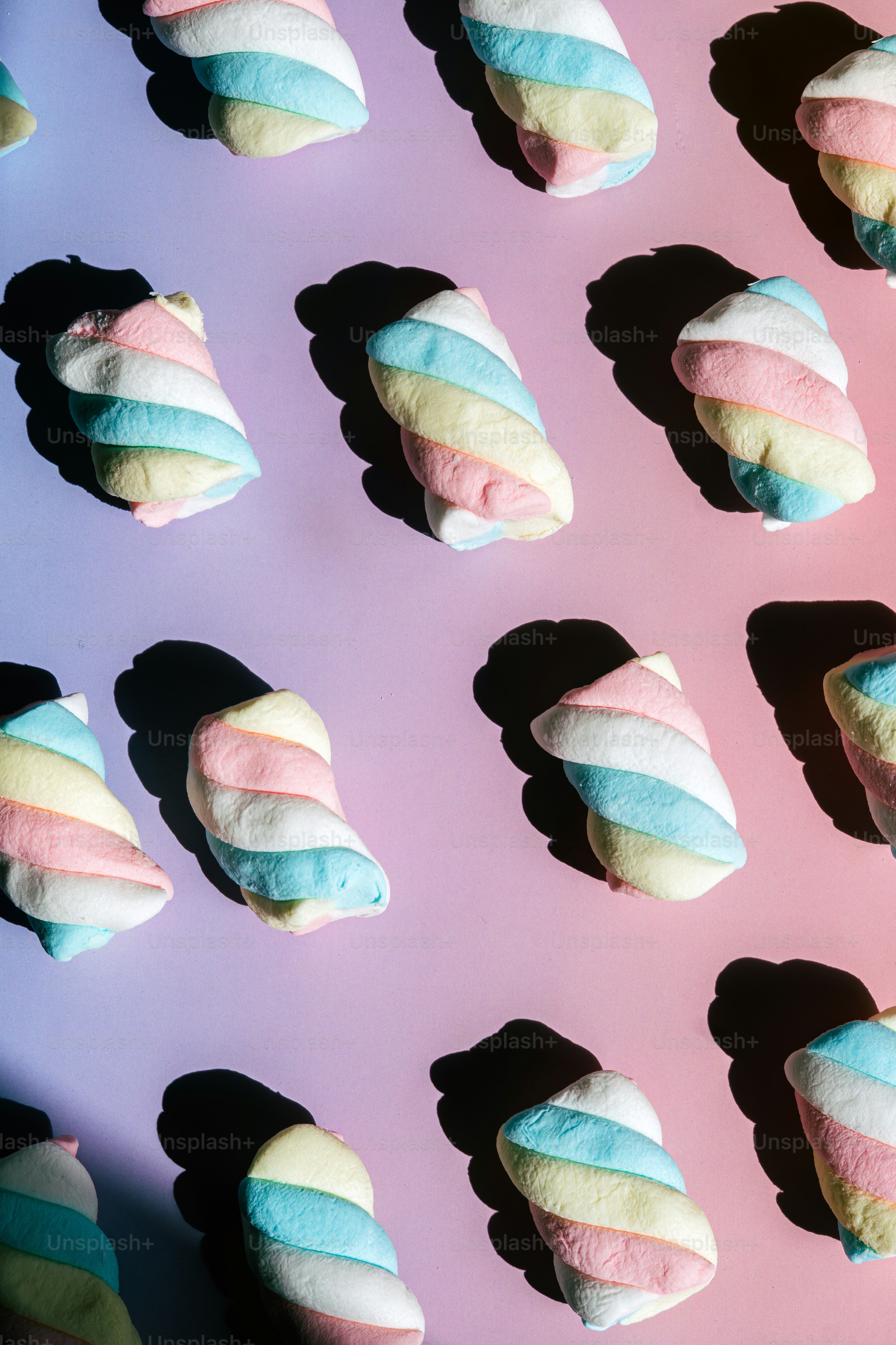 Colorful marshmallows arranged in a pattern with shadows. photo ...