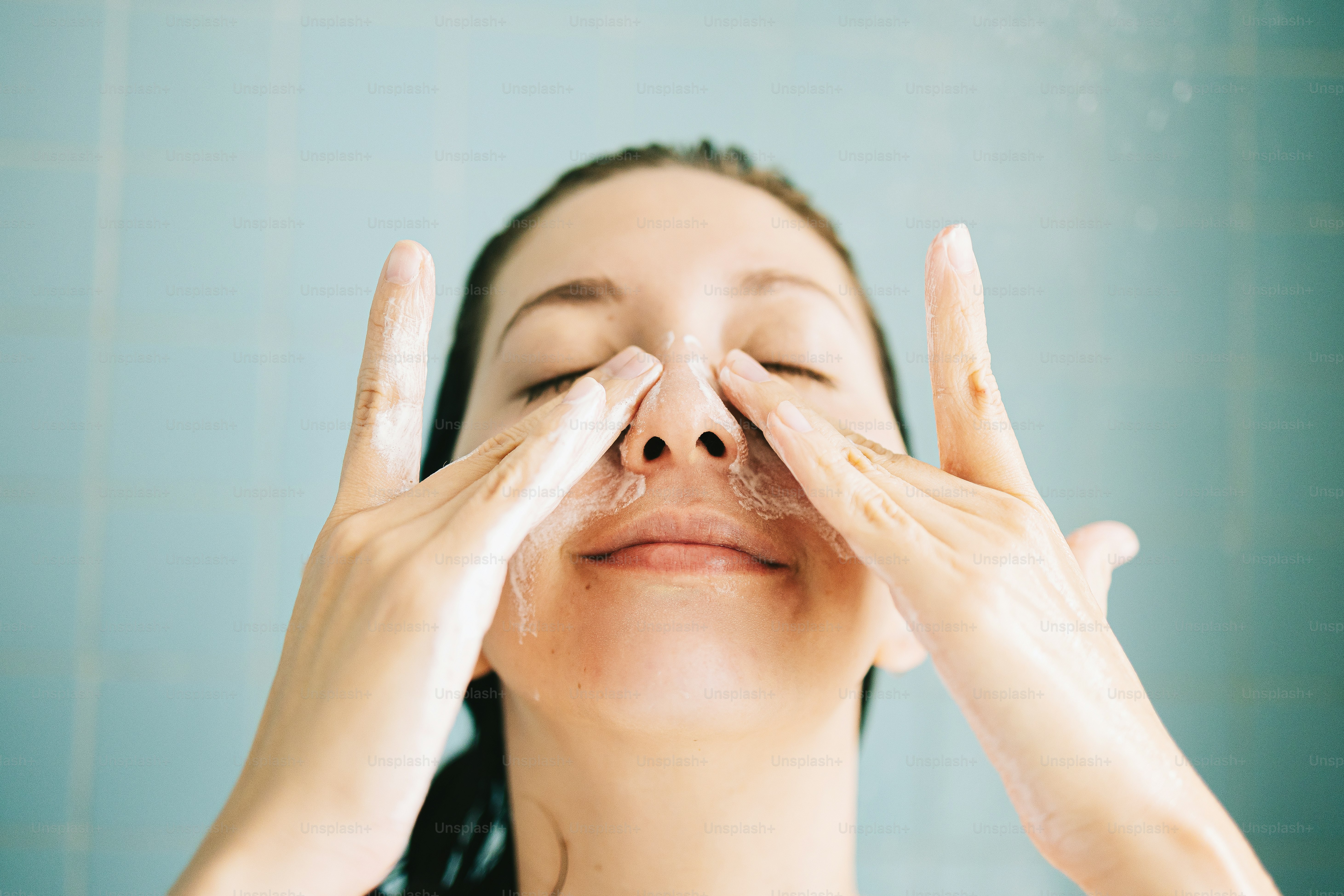 Woman washing her face with soap and water photo – Health Image on Unsplash
