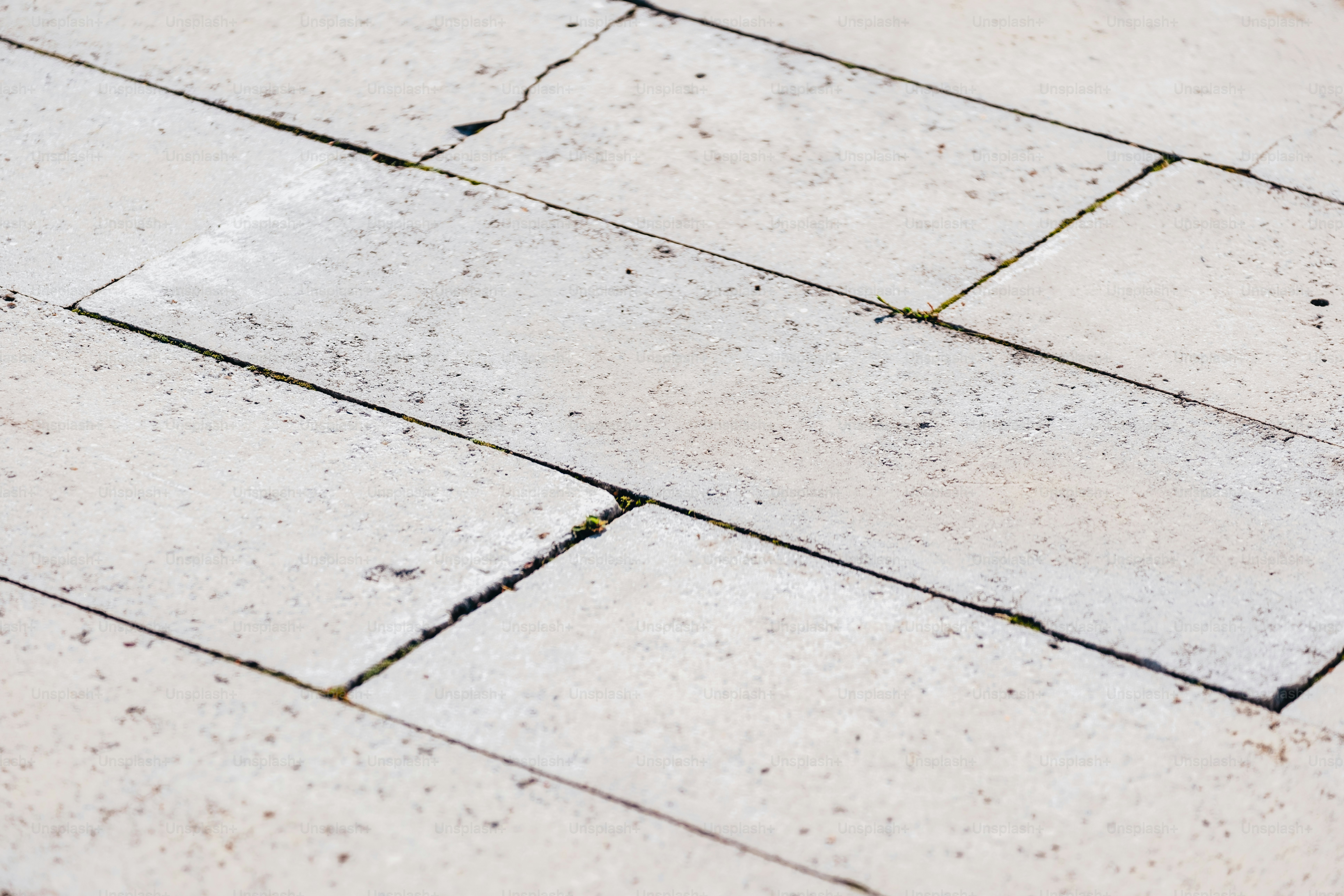 Close-up of light-colored stone paving slabs photo – Wallpaper Image on ...