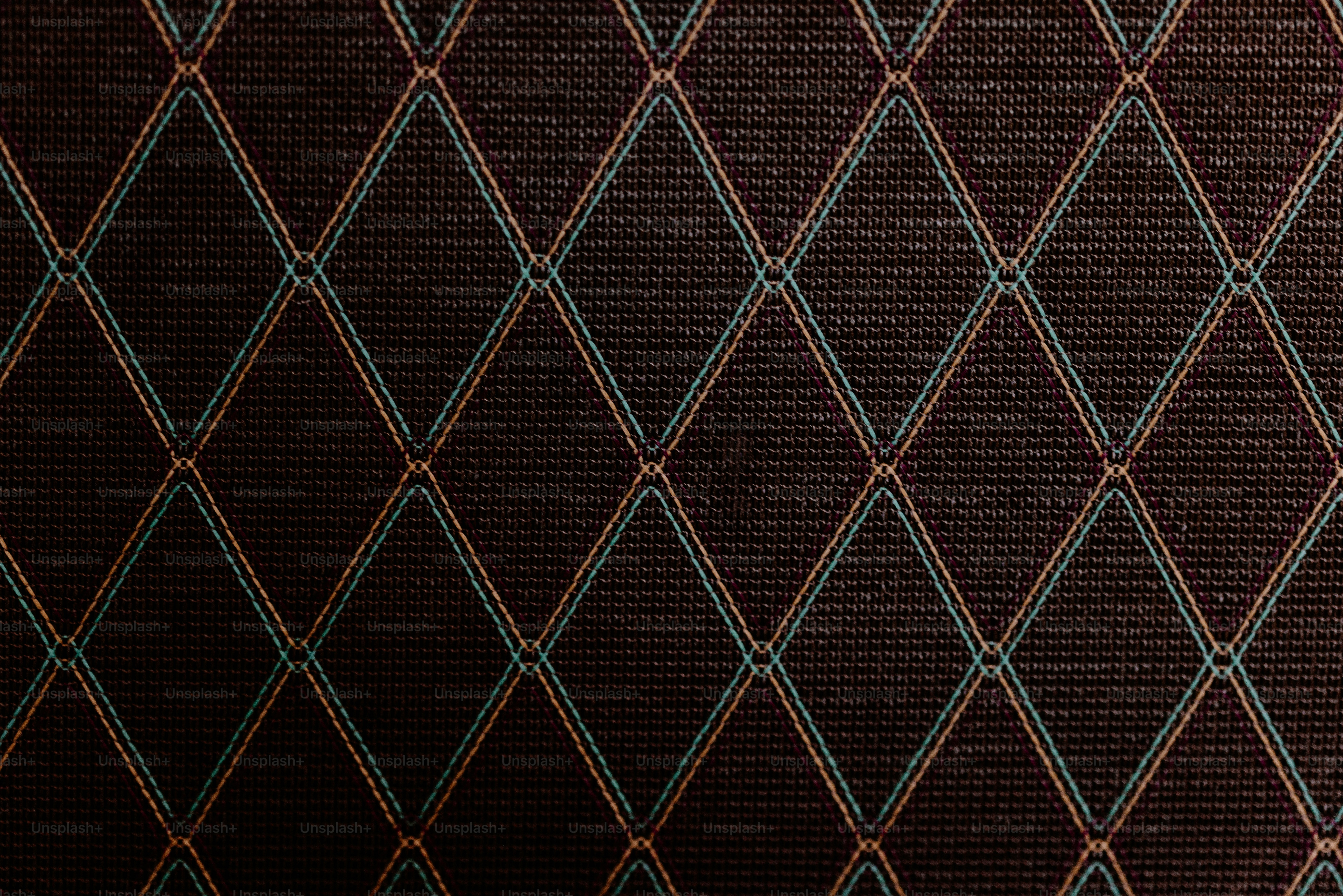 Dark textured background with repeating diamond pattern photo – Image ...