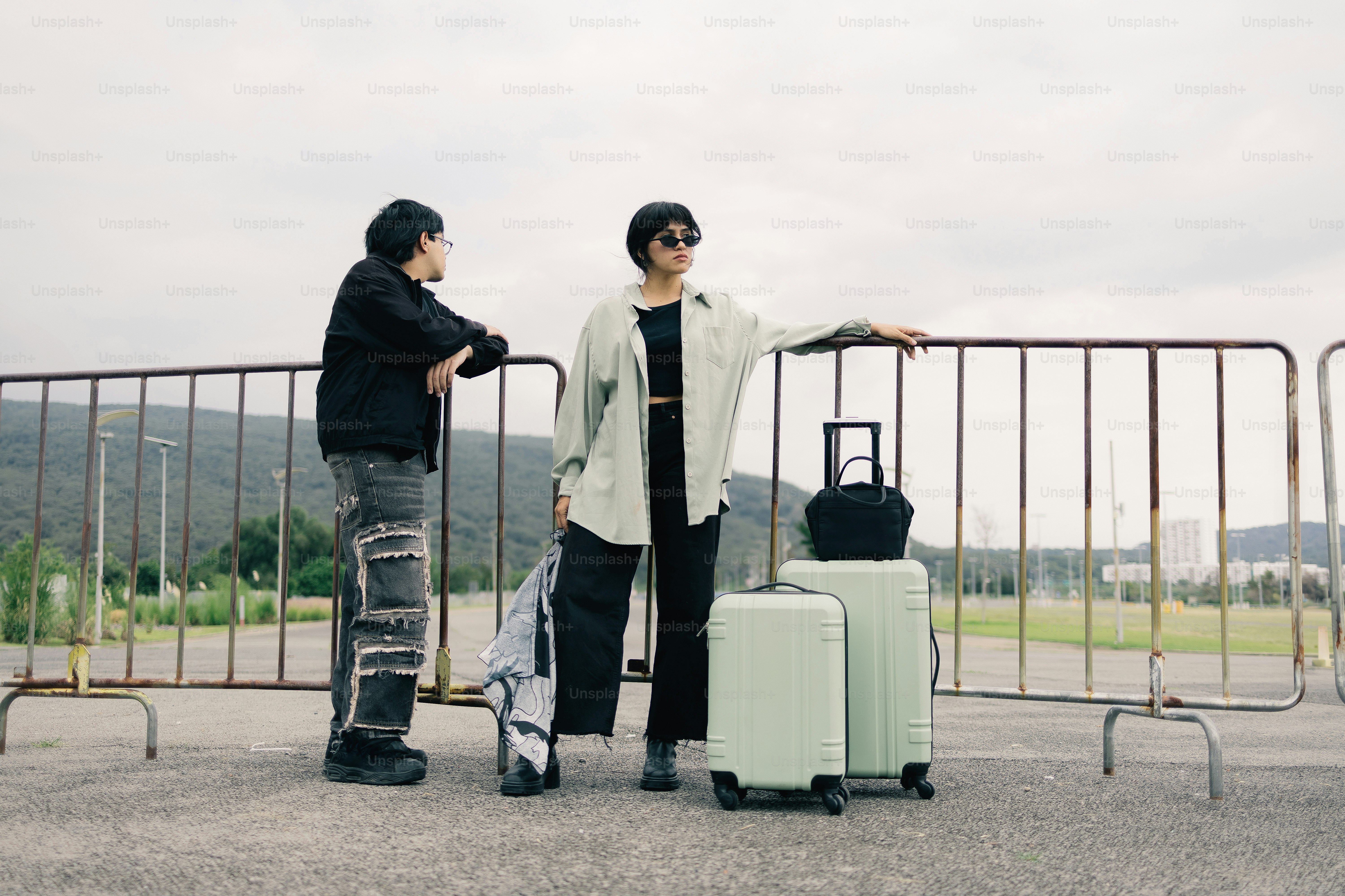 Two people with luggage on a crosswalk photo – Adventure Image on Unsplash