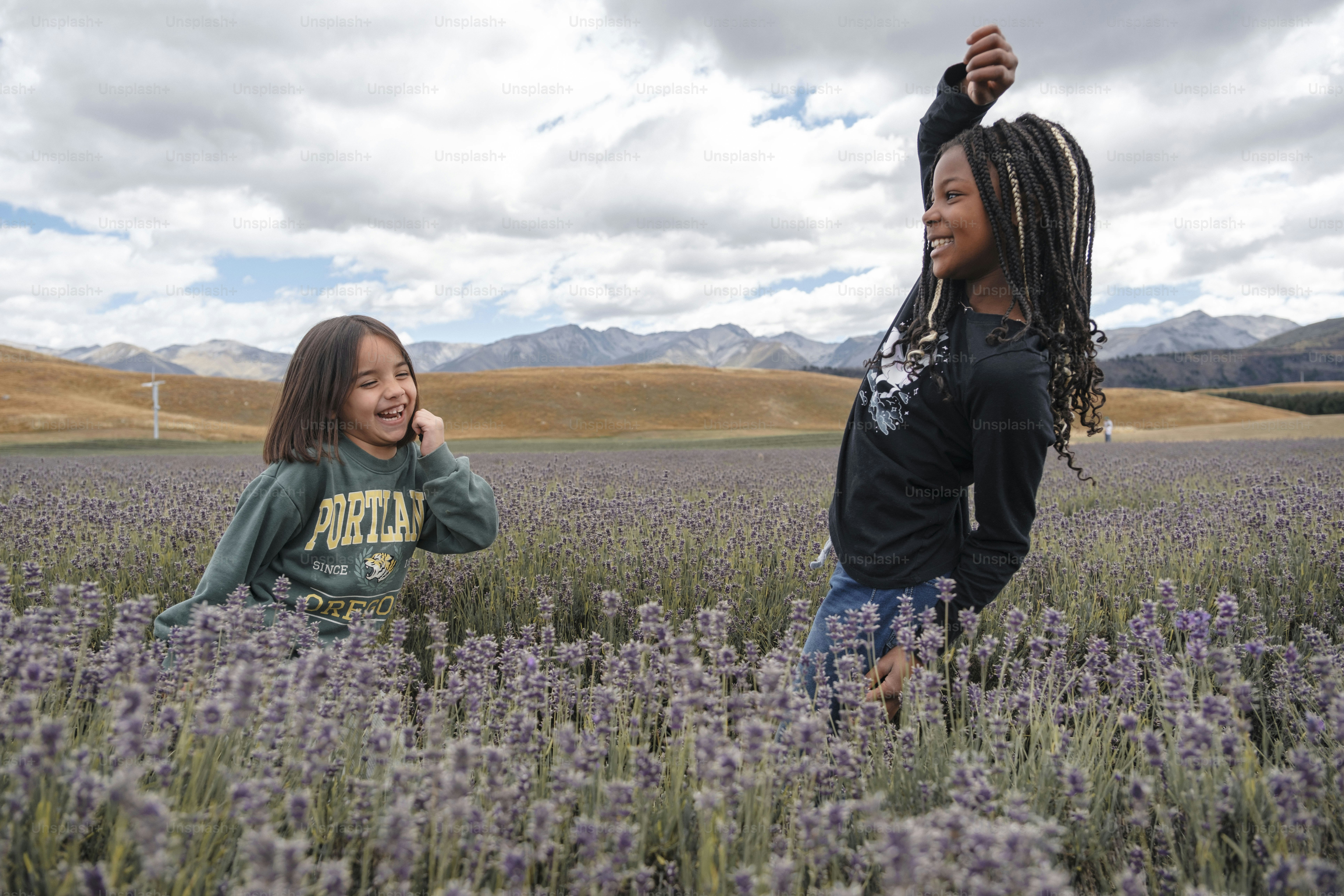 Two girls climbing a large rock outdoors photo – Travel Image on Unsplash