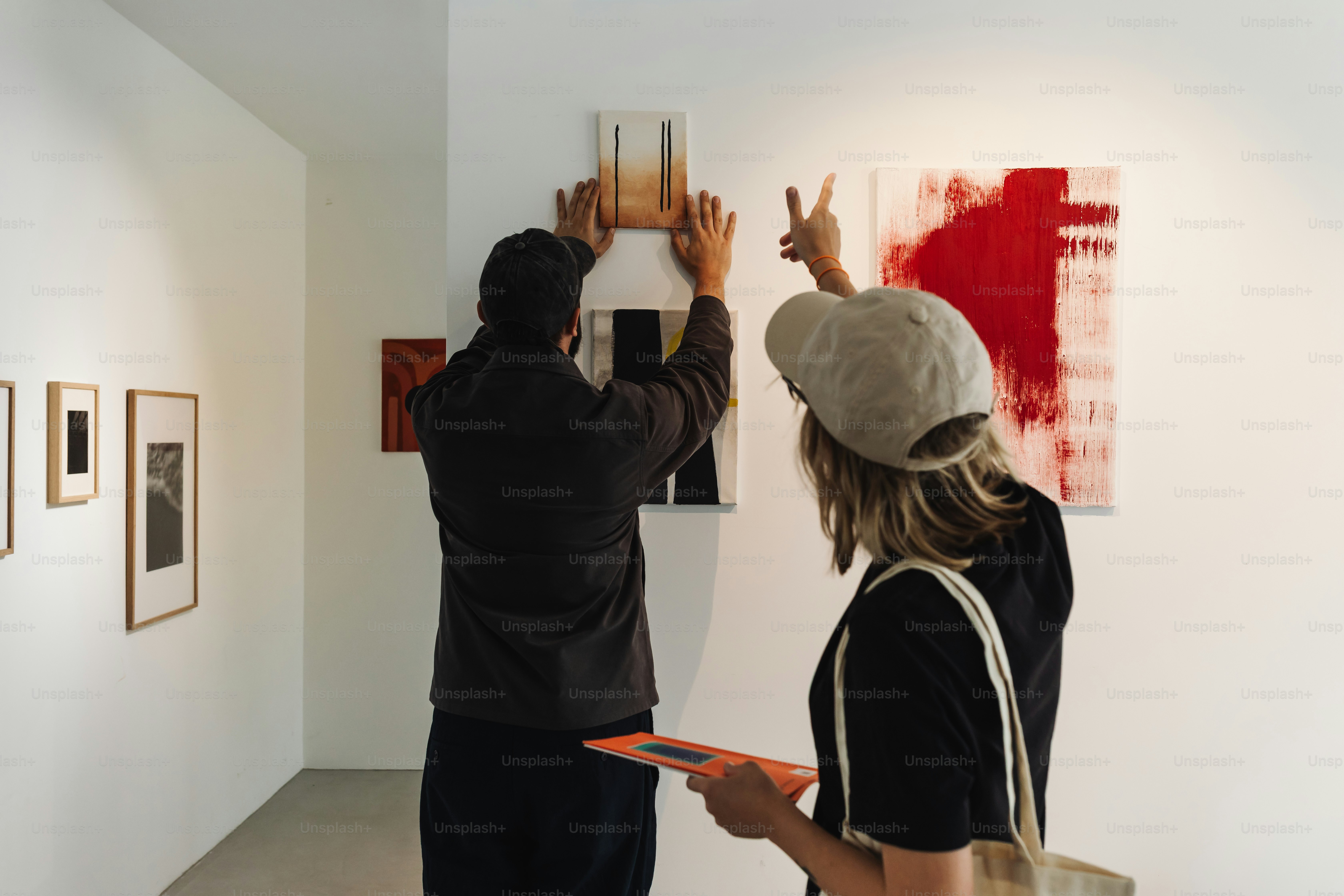 People looking at art in a modern gallery. photo – Art gallery Image on ...