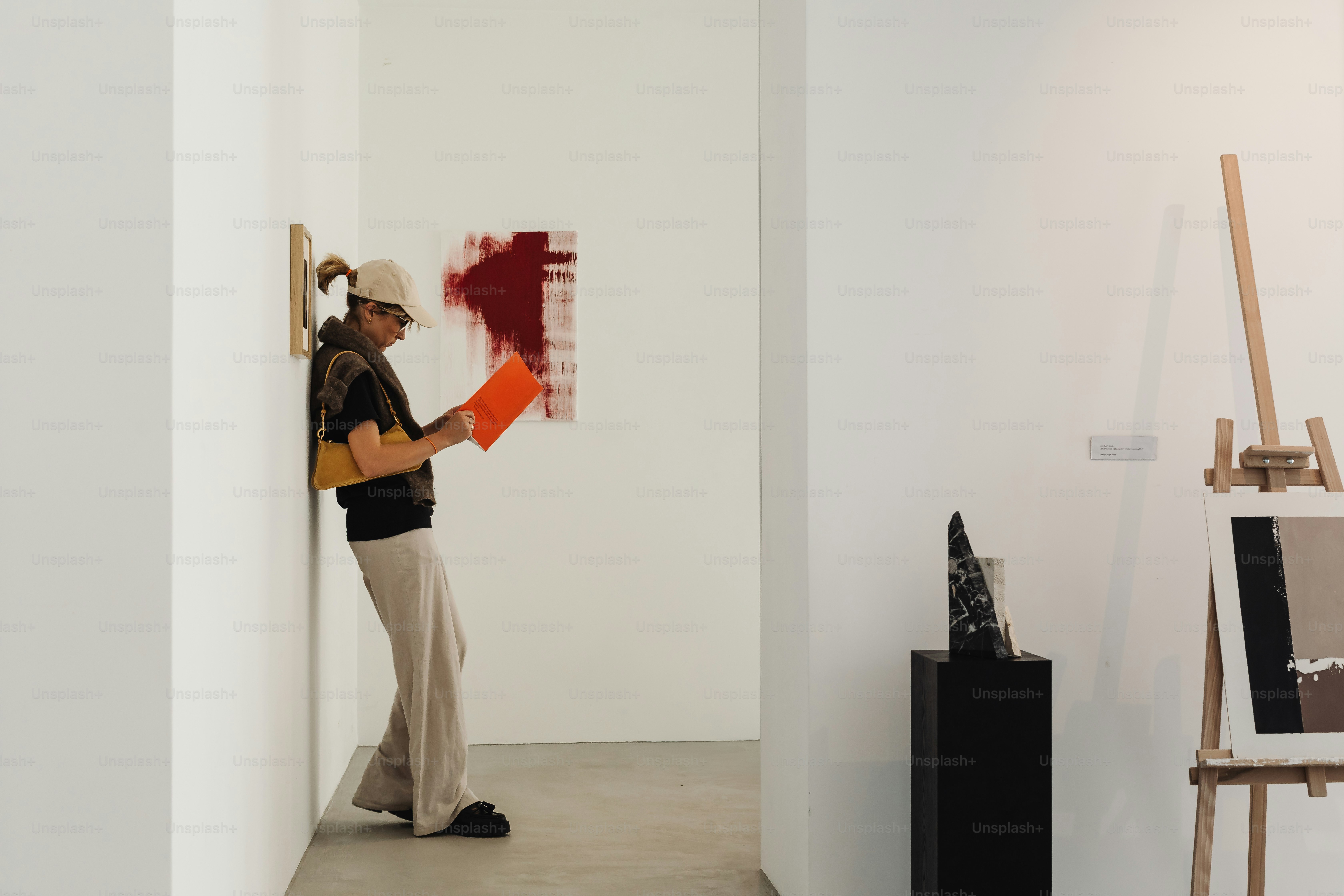 People looking at art in a modern gallery. photo – Art gallery Image on ...