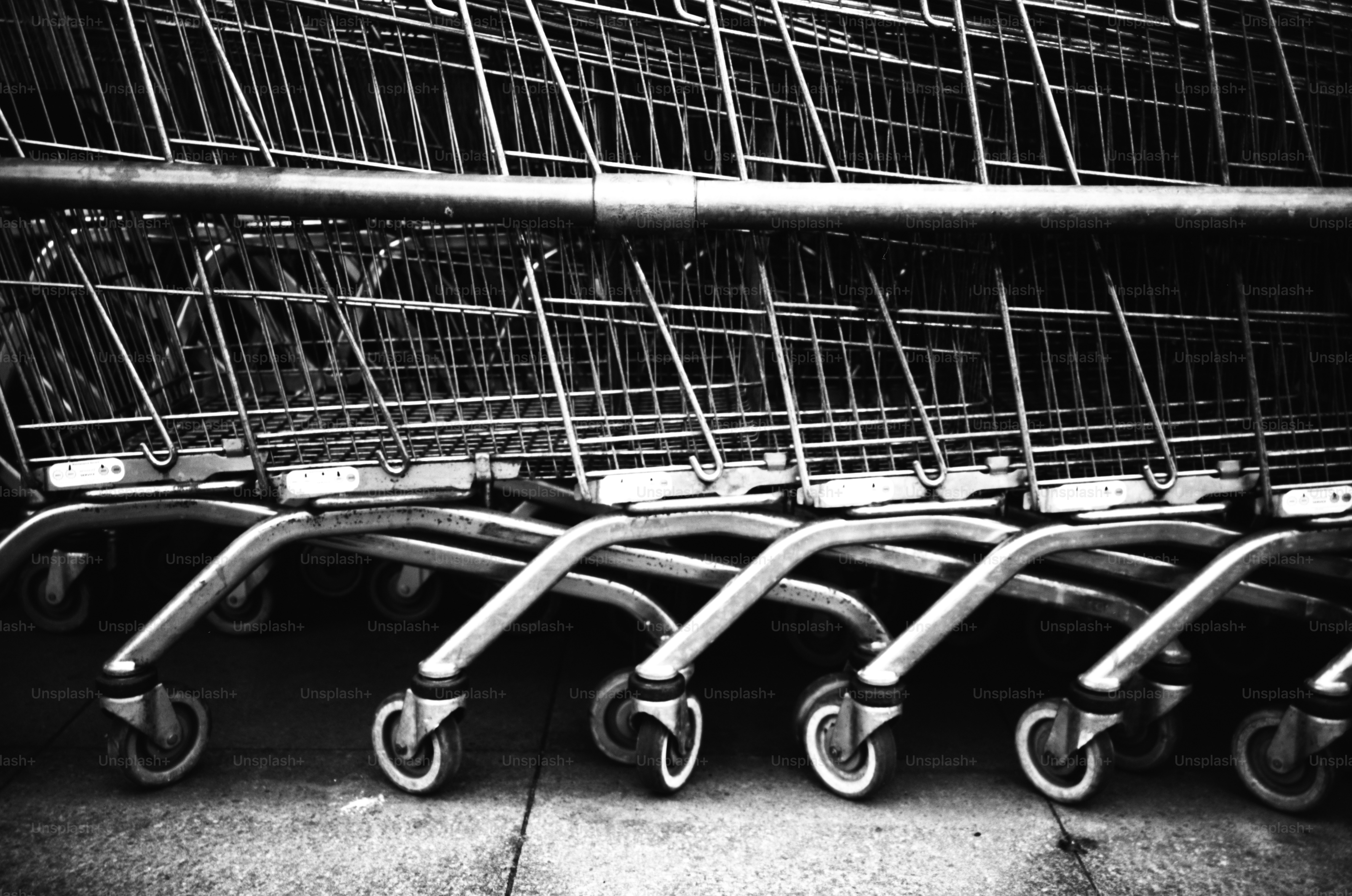 Row of stacked shopping carts with wheels photo – Film photography ...