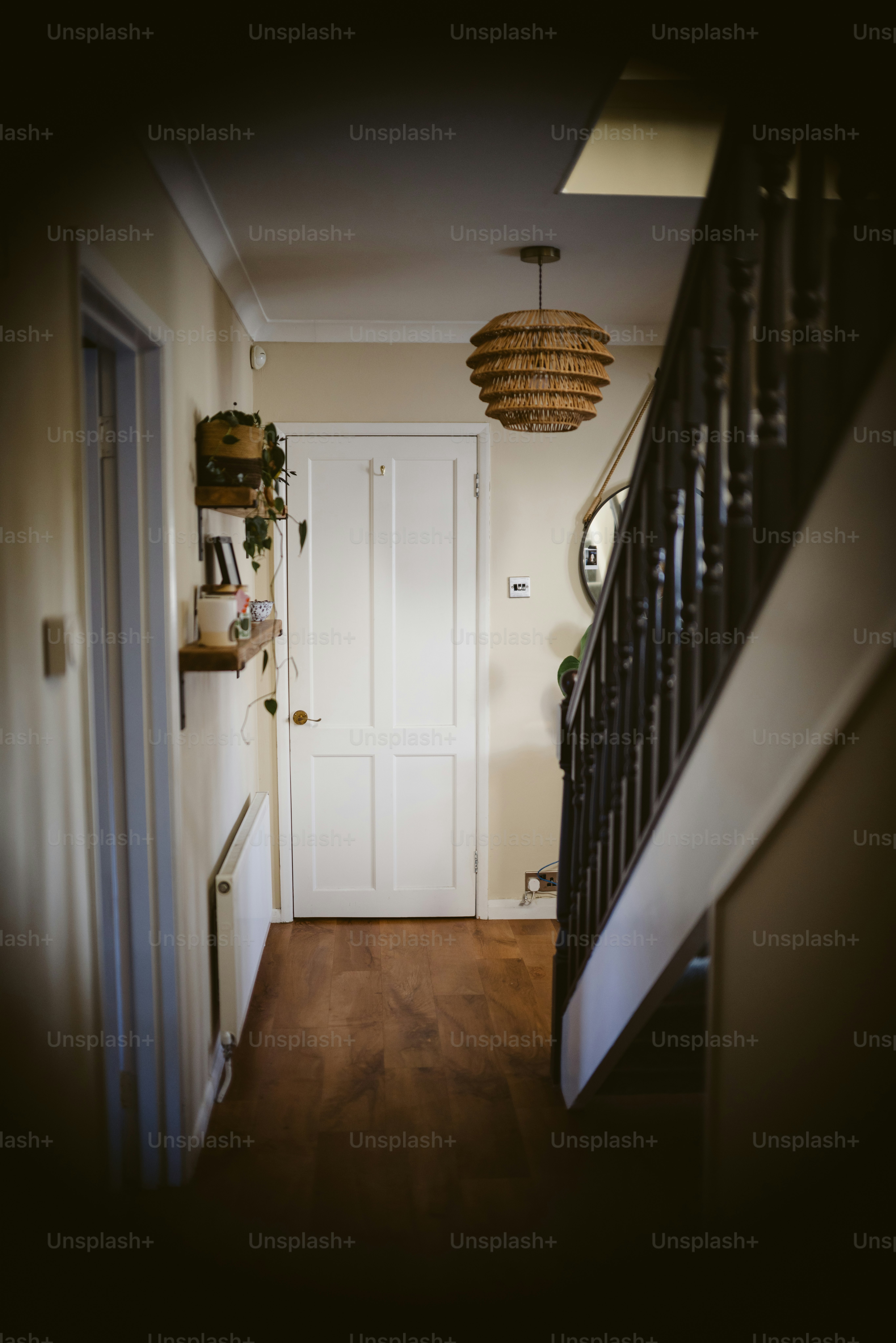 Hallway with stairs and a closed door photo – Home Image on Unsplash