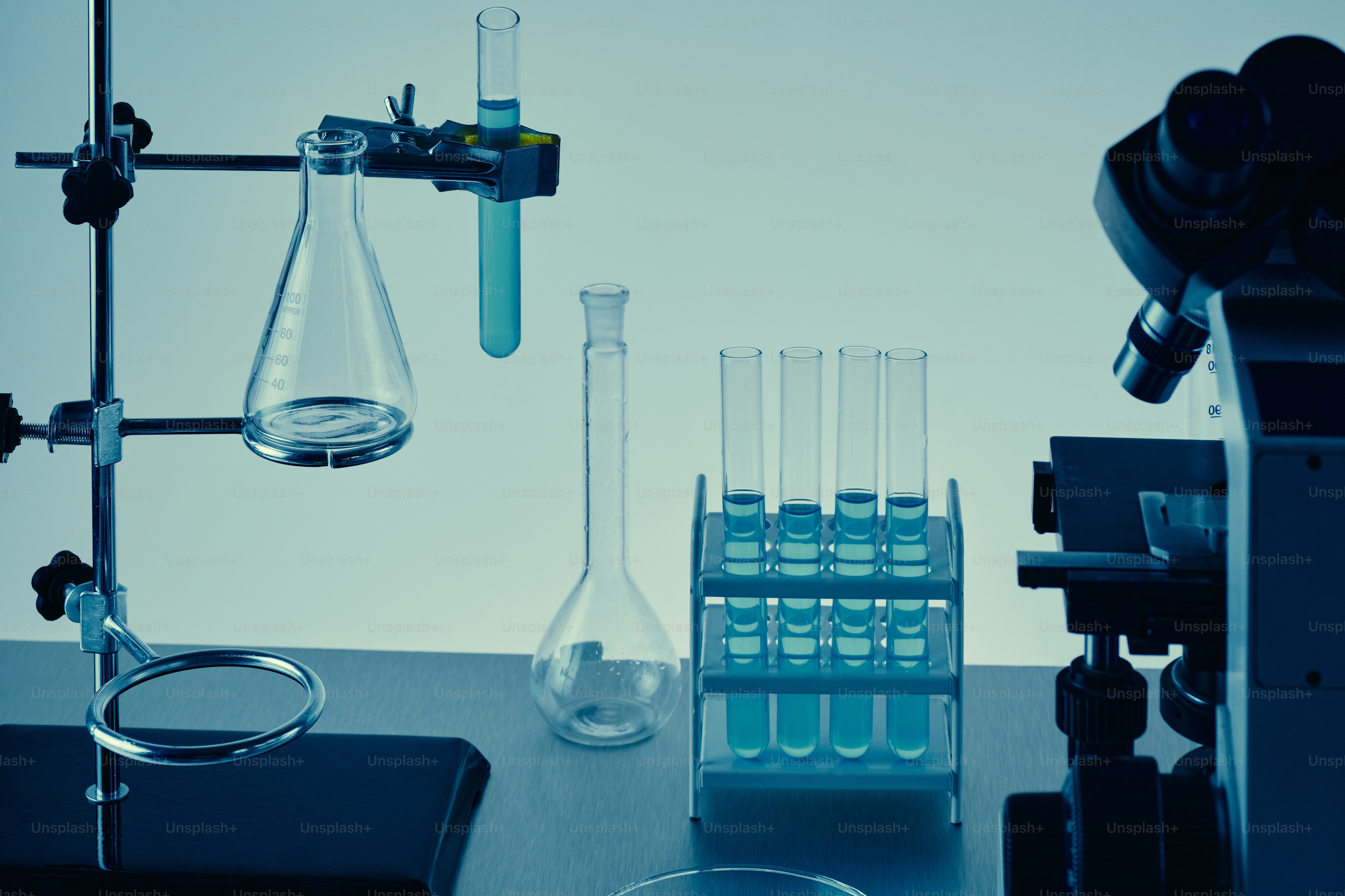 Laboratory equipment with test tubes and microscope photo – Science ...