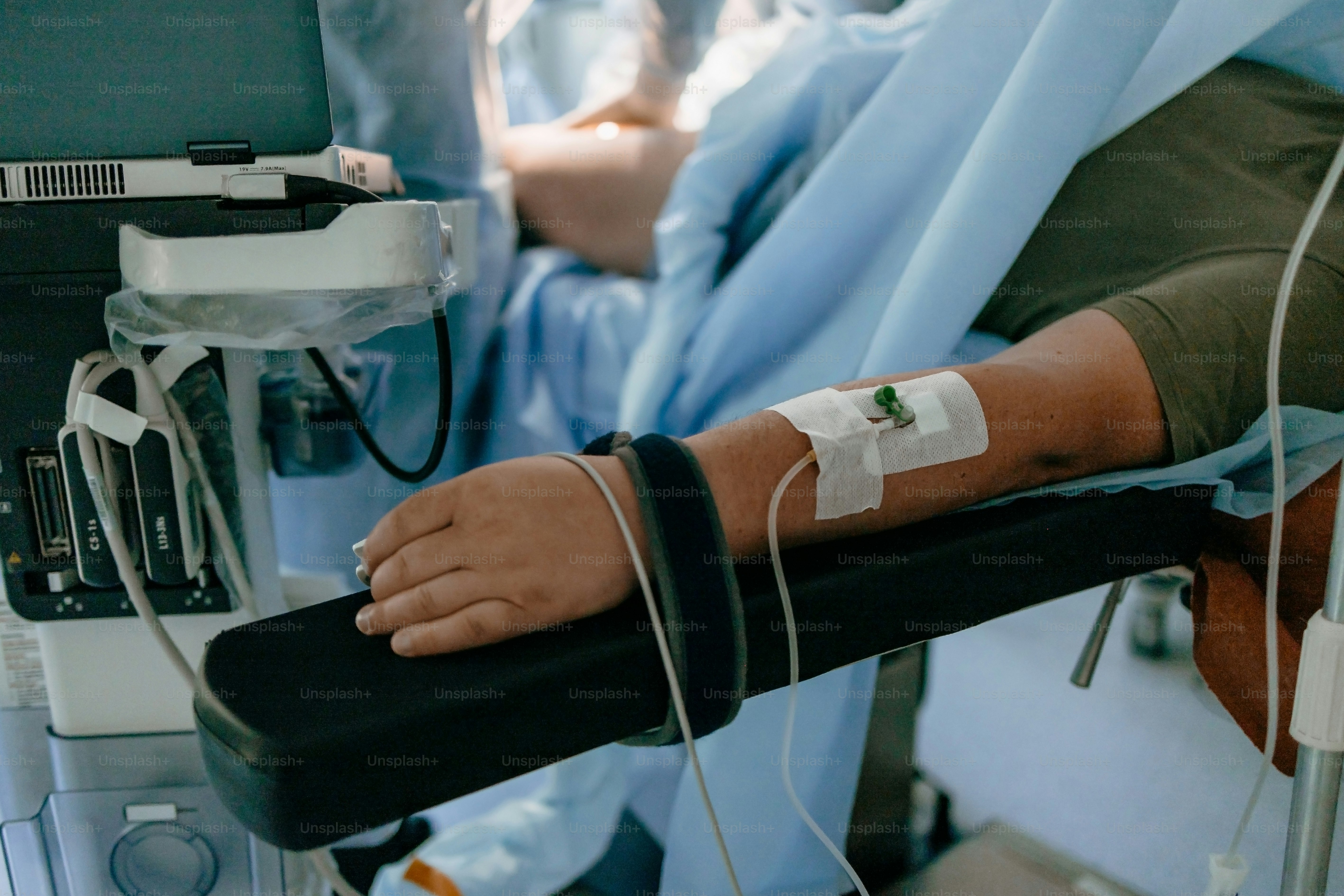 Patient's arm with iv drip in operating room. photo – Health Image on ...