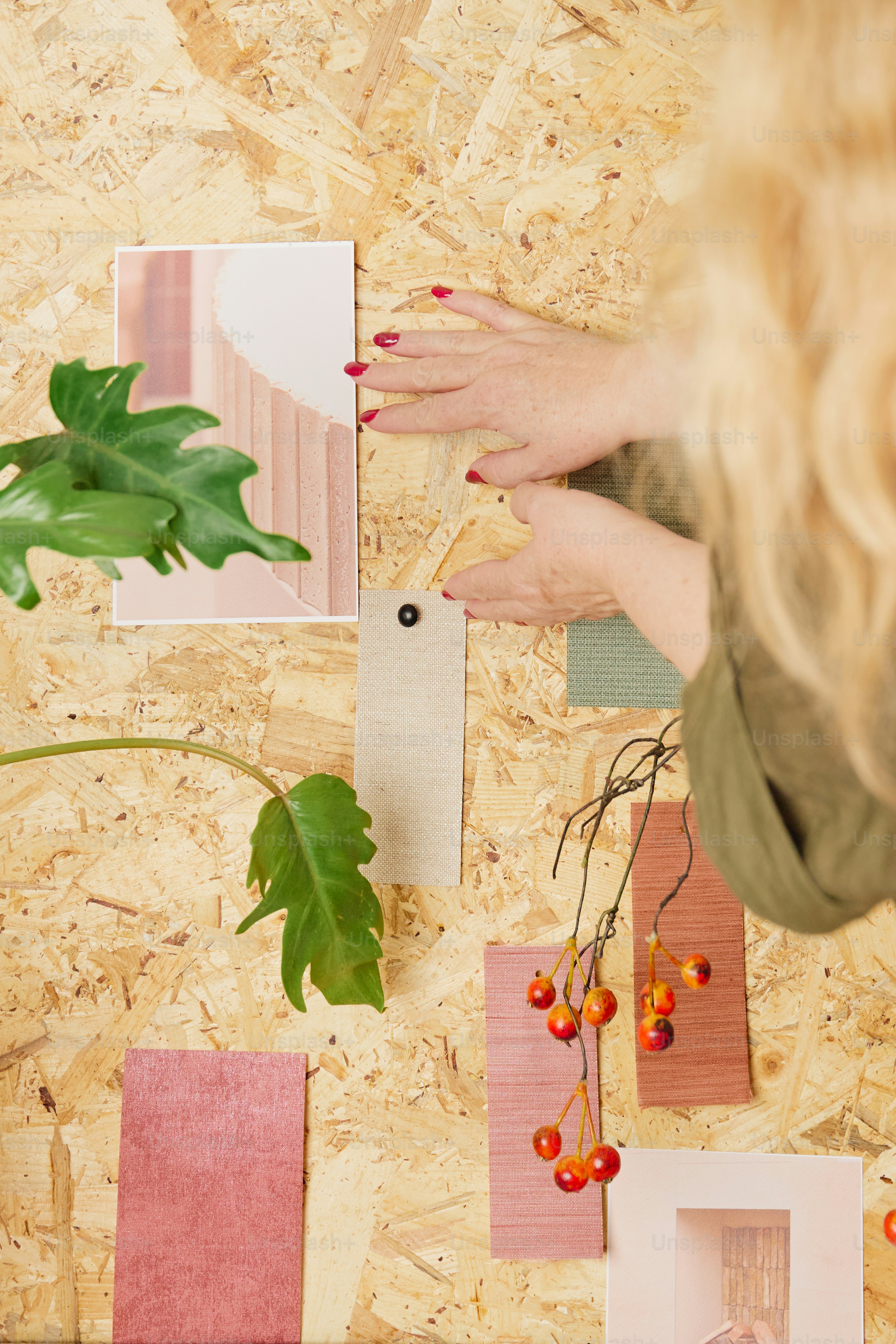 Hands holding color swatches and tablet with interior design. photo ...