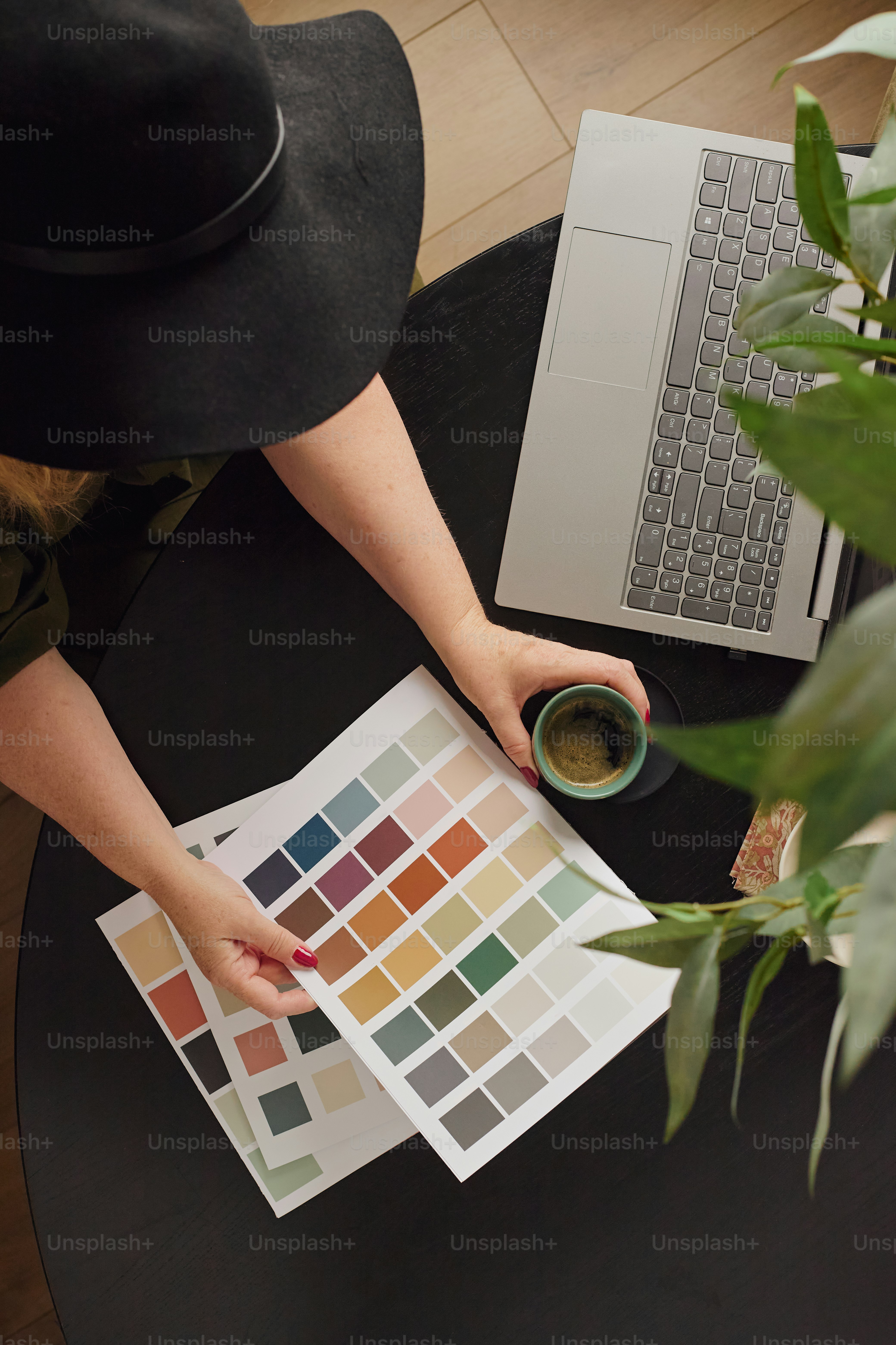 Hands holding color swatches and tablet with interior design. photo ...