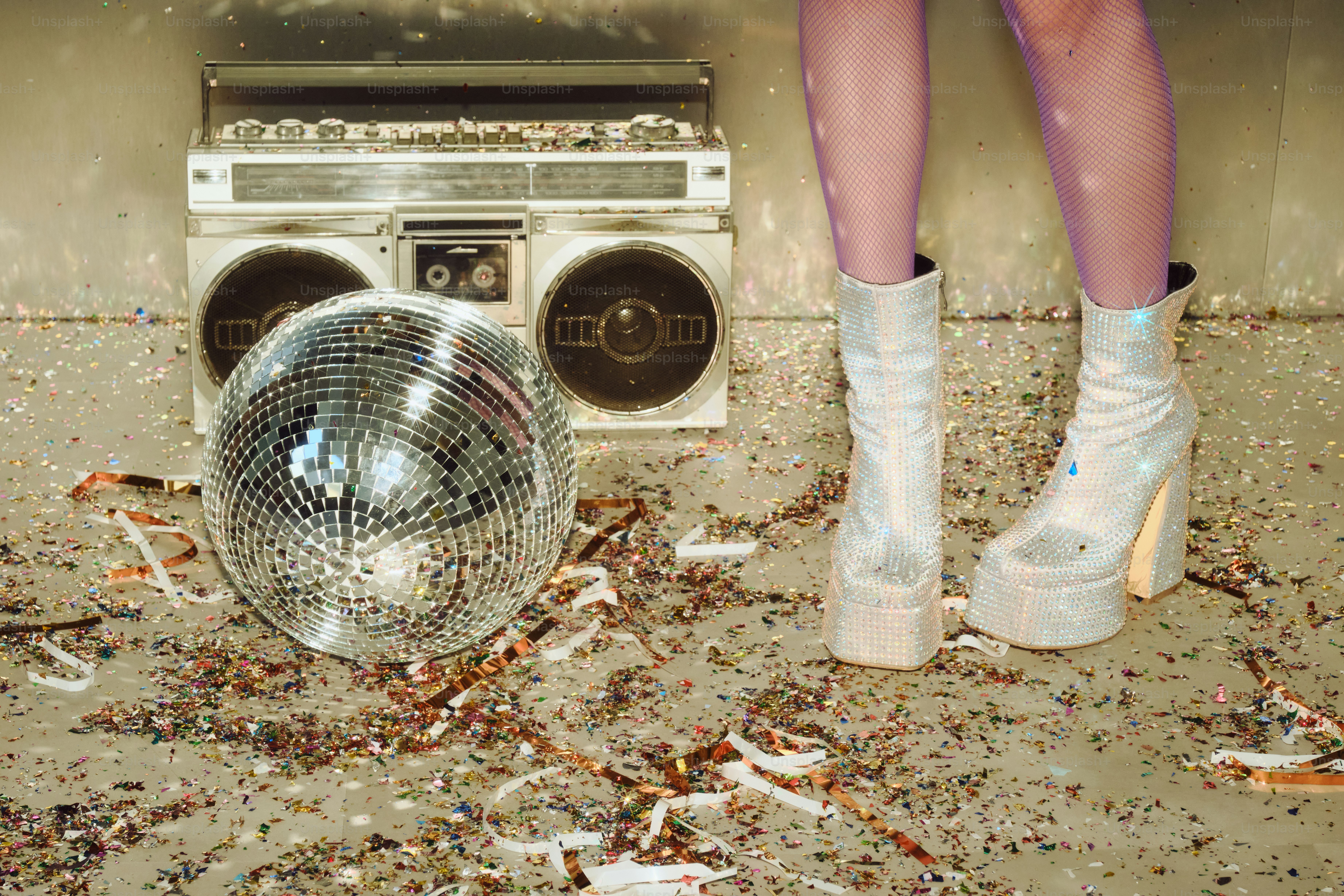 Woman in sparkly outfit sits near disco ball. photo – Fashion Image on ...