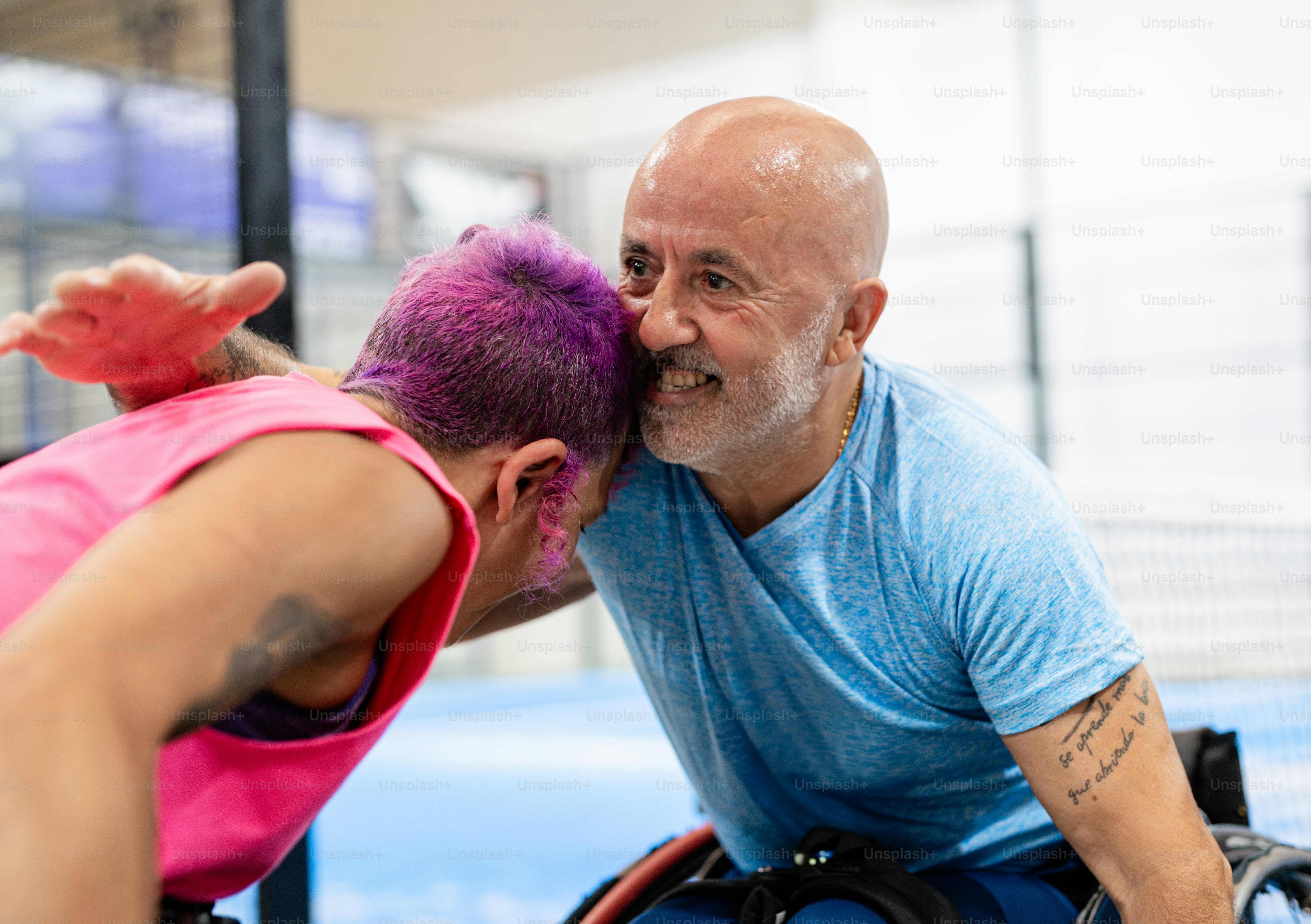 Two people in wheelchairs embracing warmly photo – Sport Image on Unsplash
