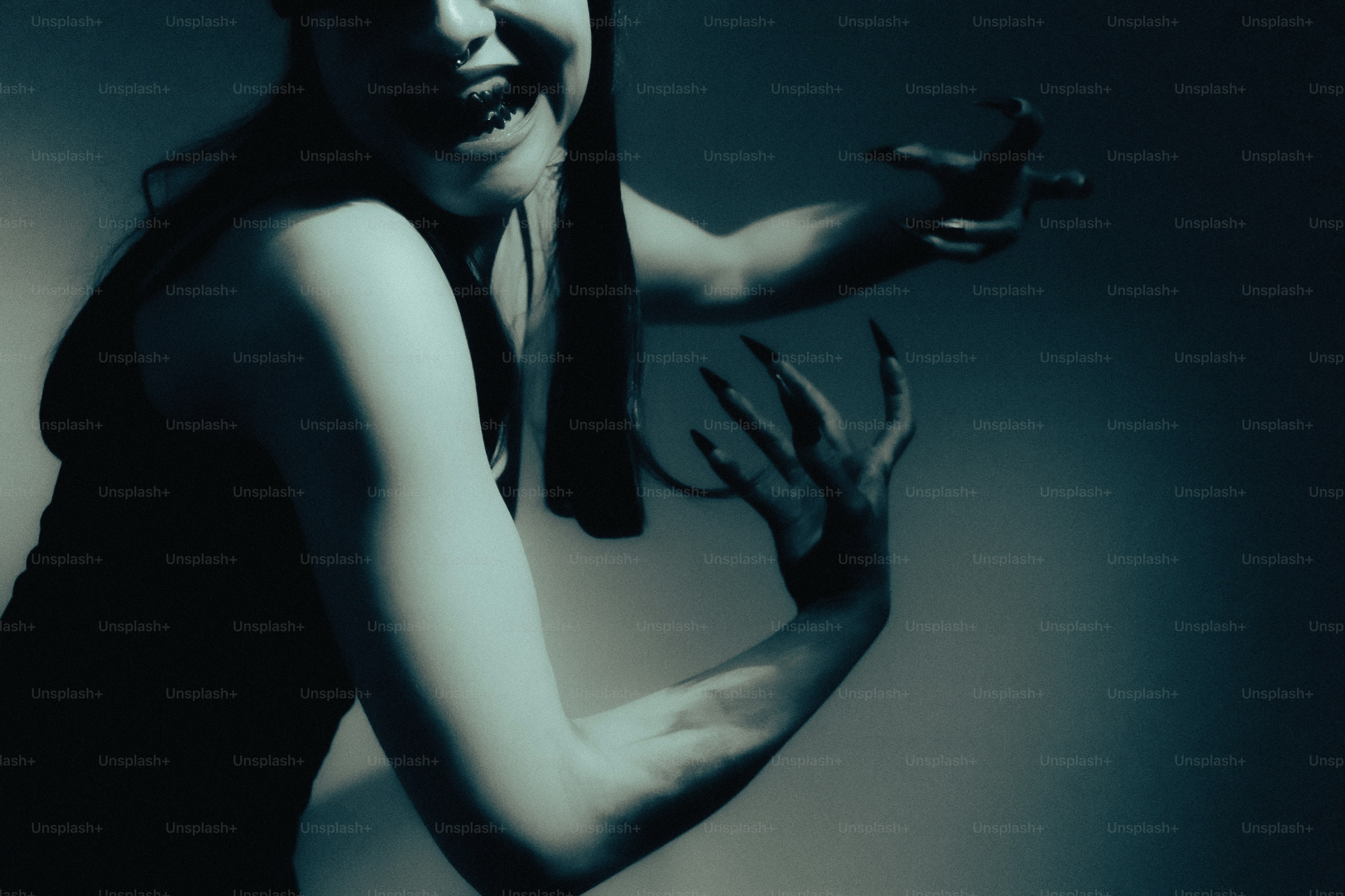 Woman with sharp claws and fangs snarling photo – Dark Image on Unsplash