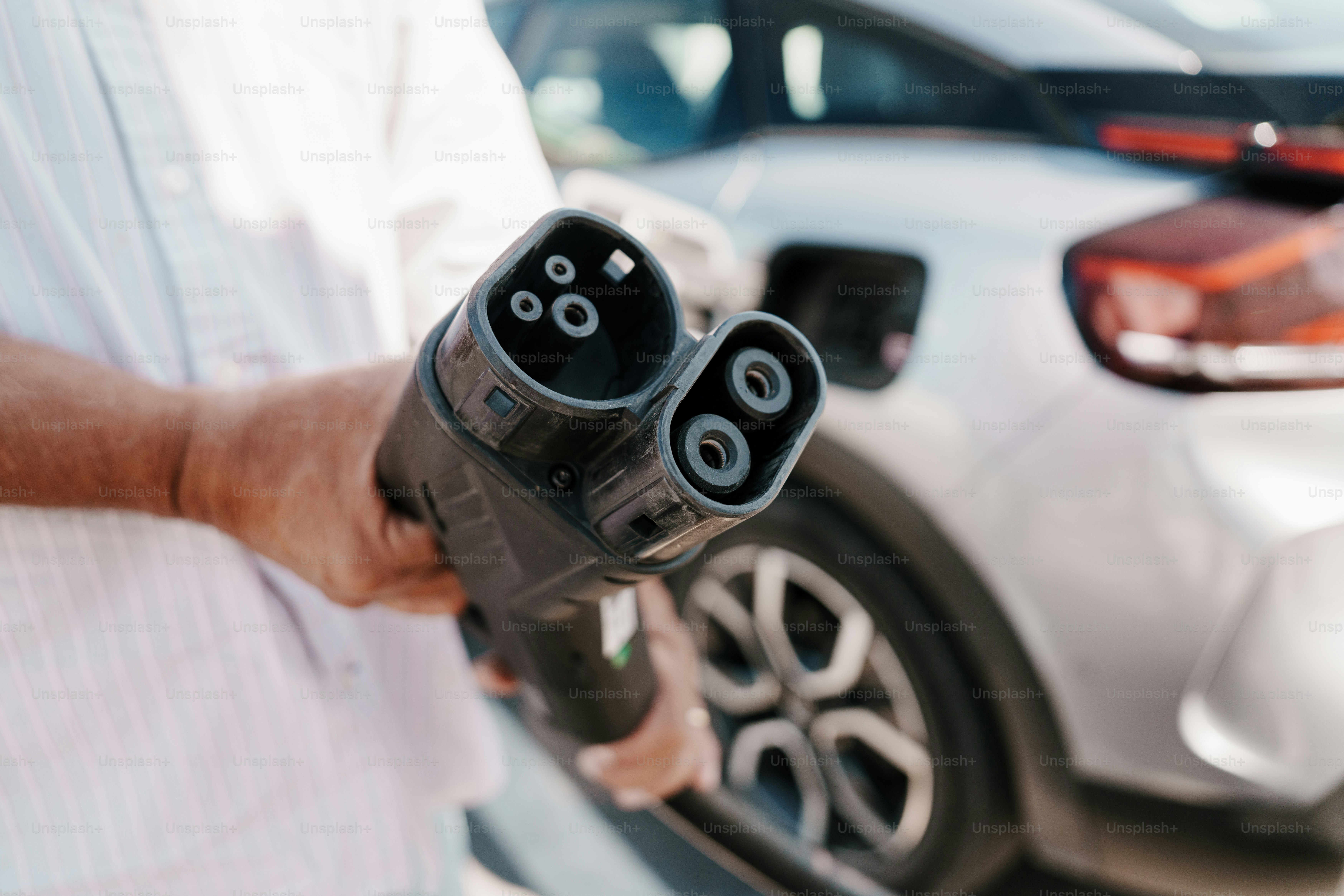 Electric car charging symbol painted on asphalt photo – Electric car ...