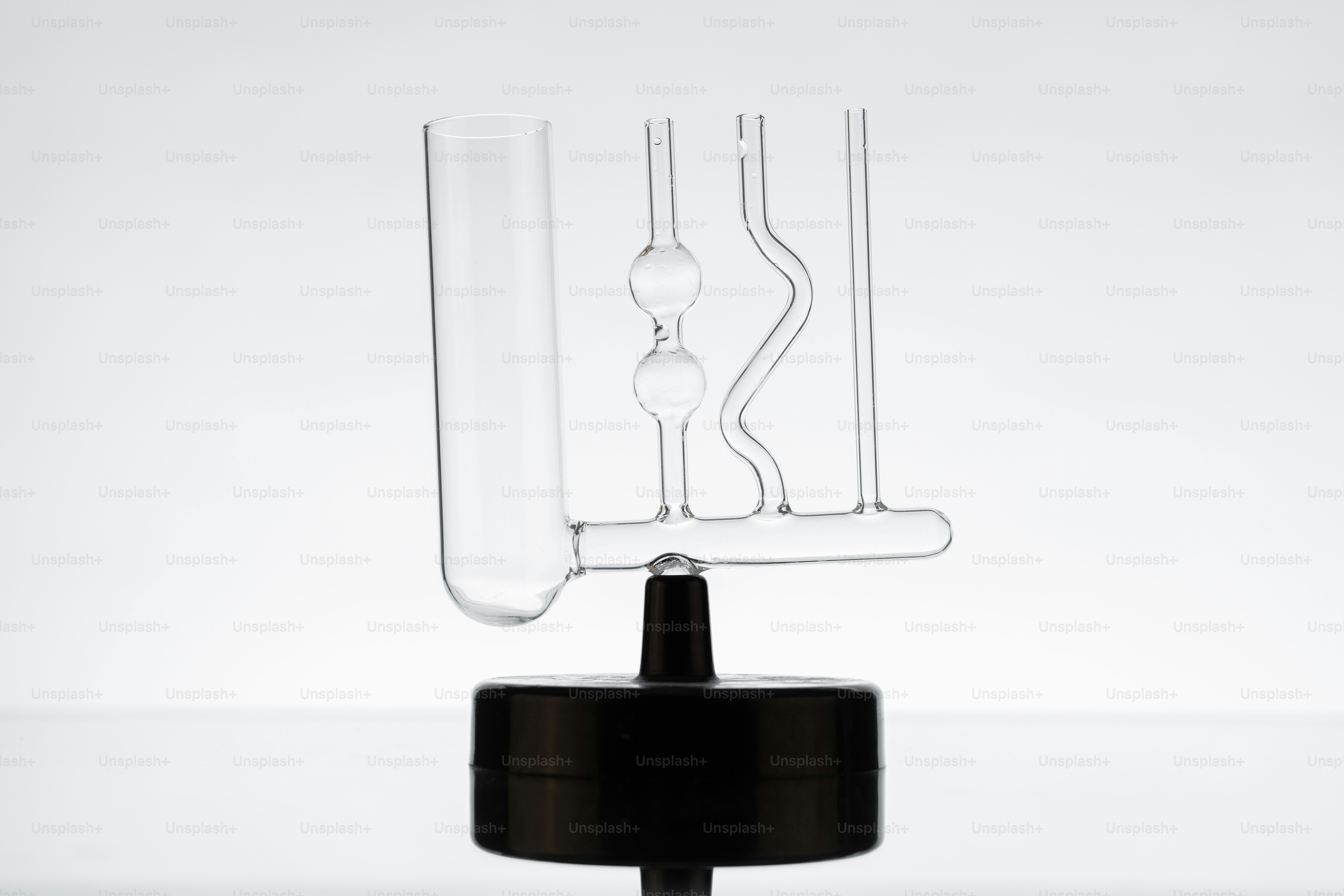 Clear glass laboratory apparatus on black base photo – Science Image on ...