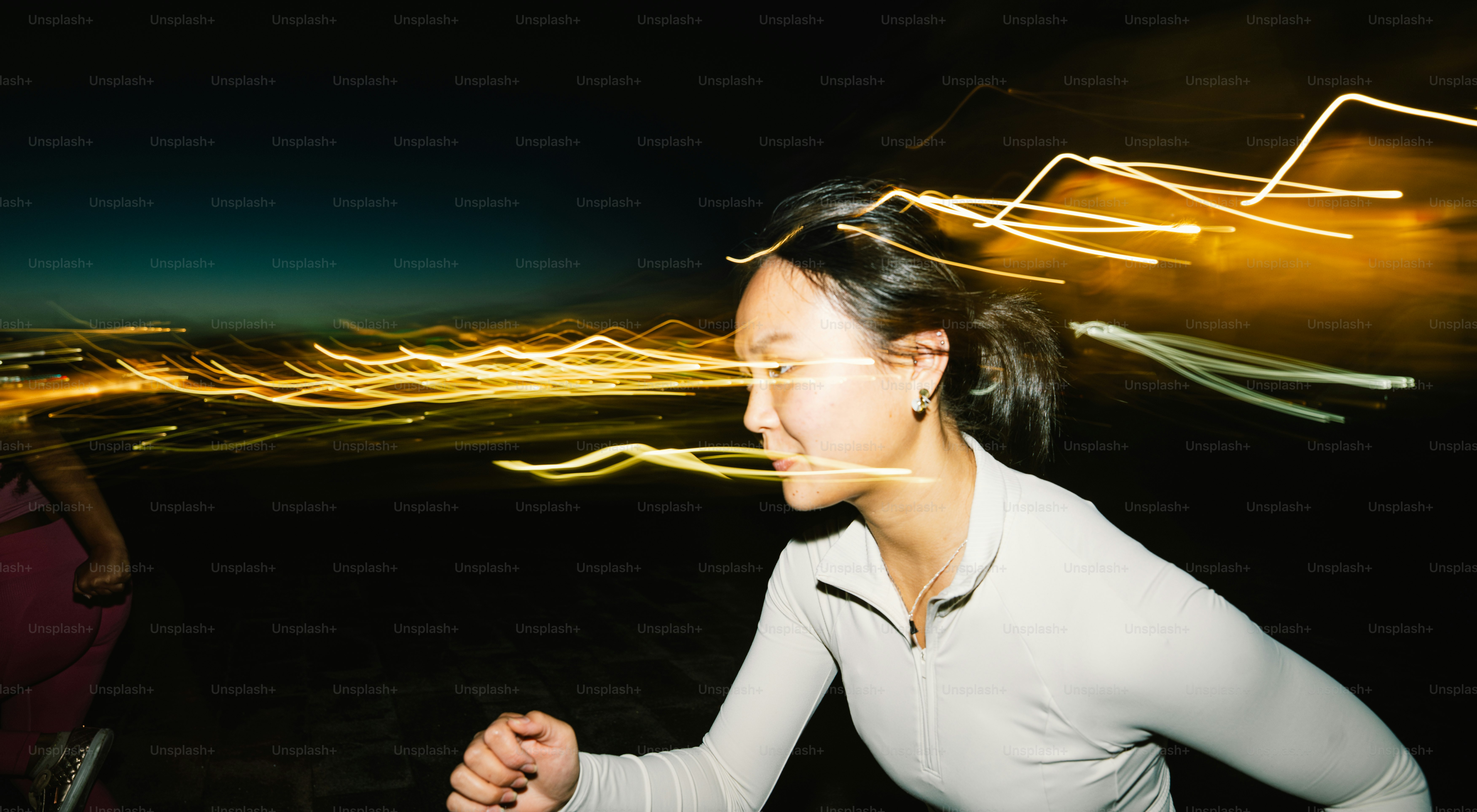 Woman running at night with light streaks photo – Portrait Image on ...