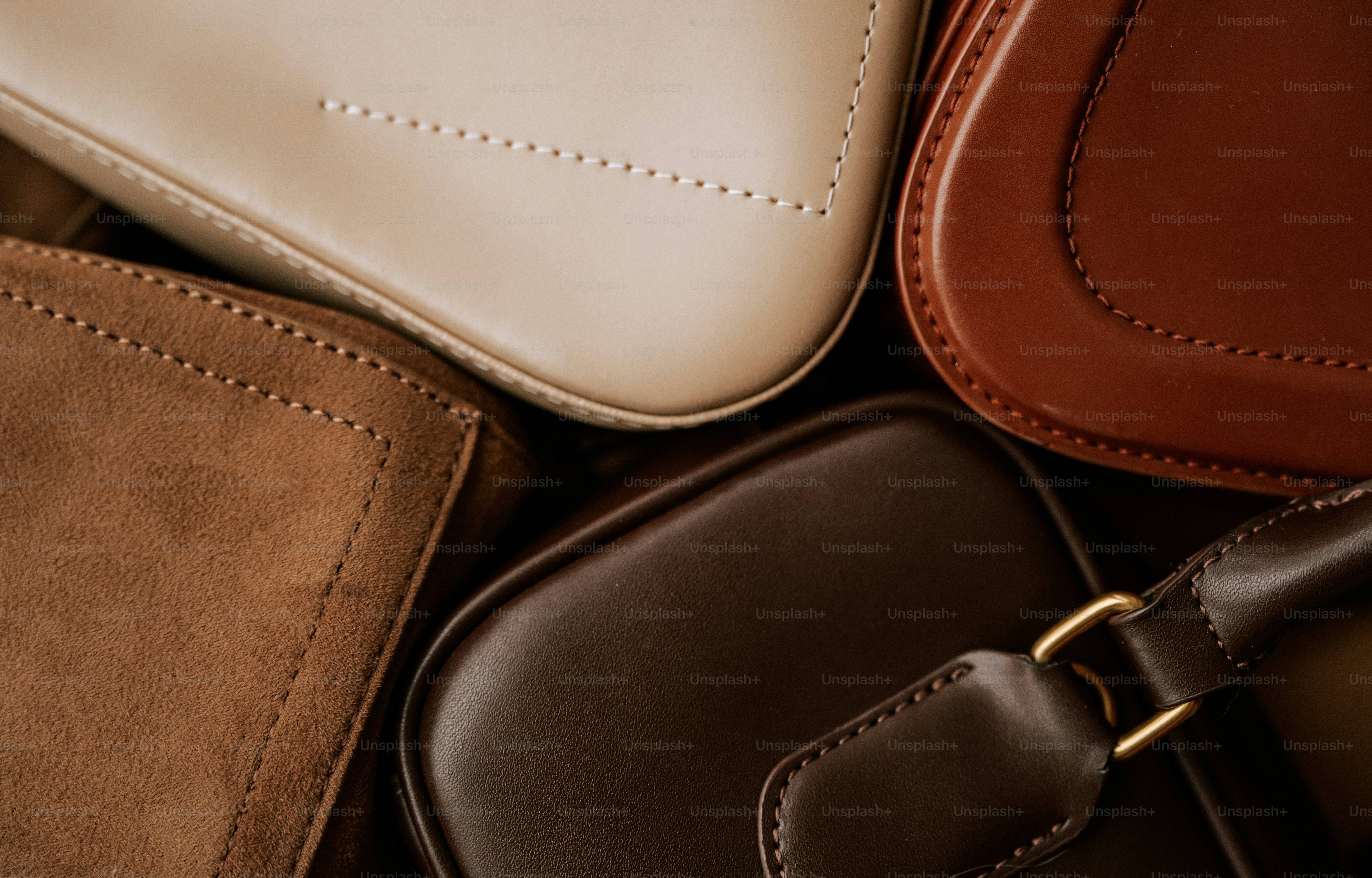Assortment of leather handbags in neutral tones. photo – Texture Image ...