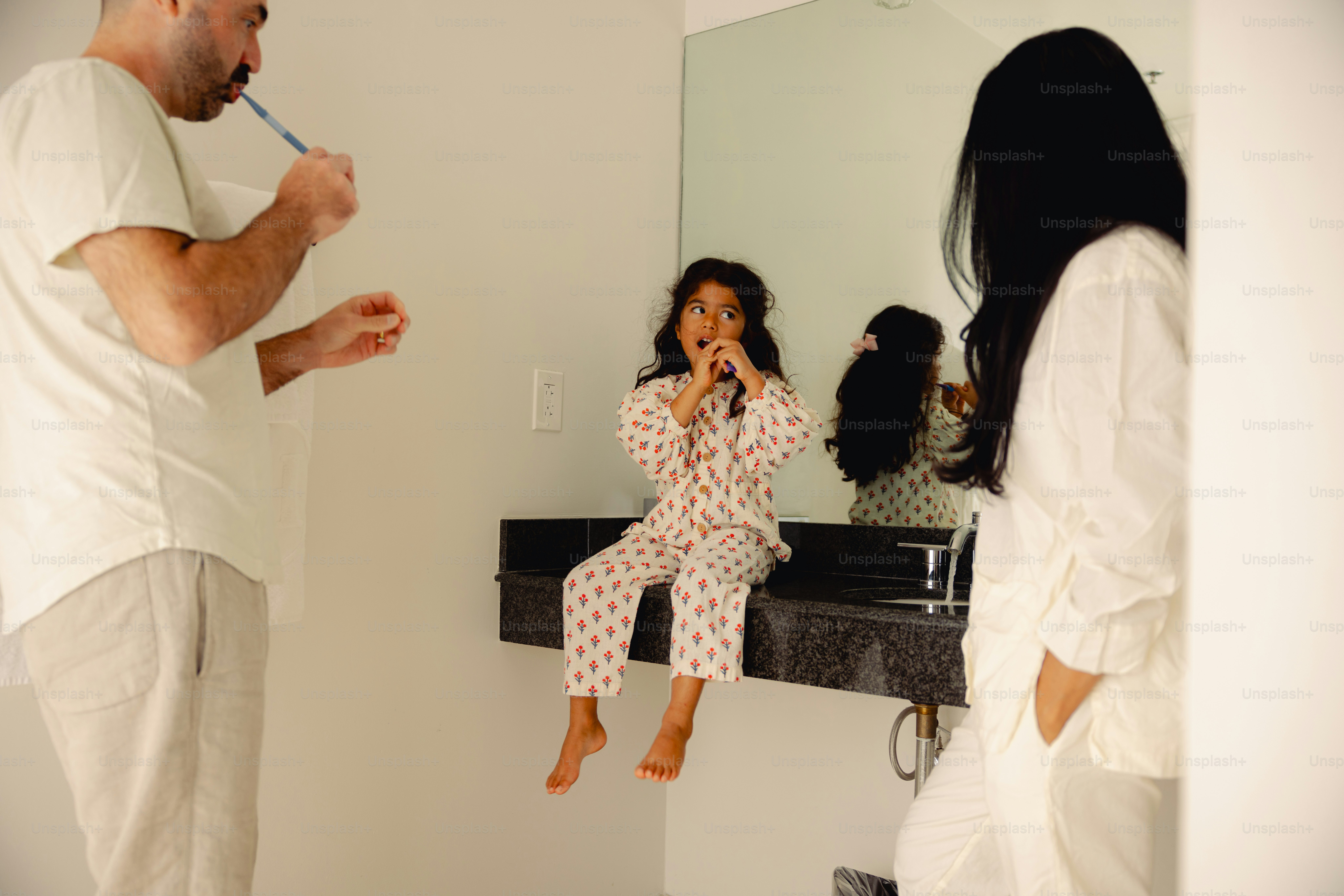 Family sleeping peacefully together in bed. photo – Family Image on ...
