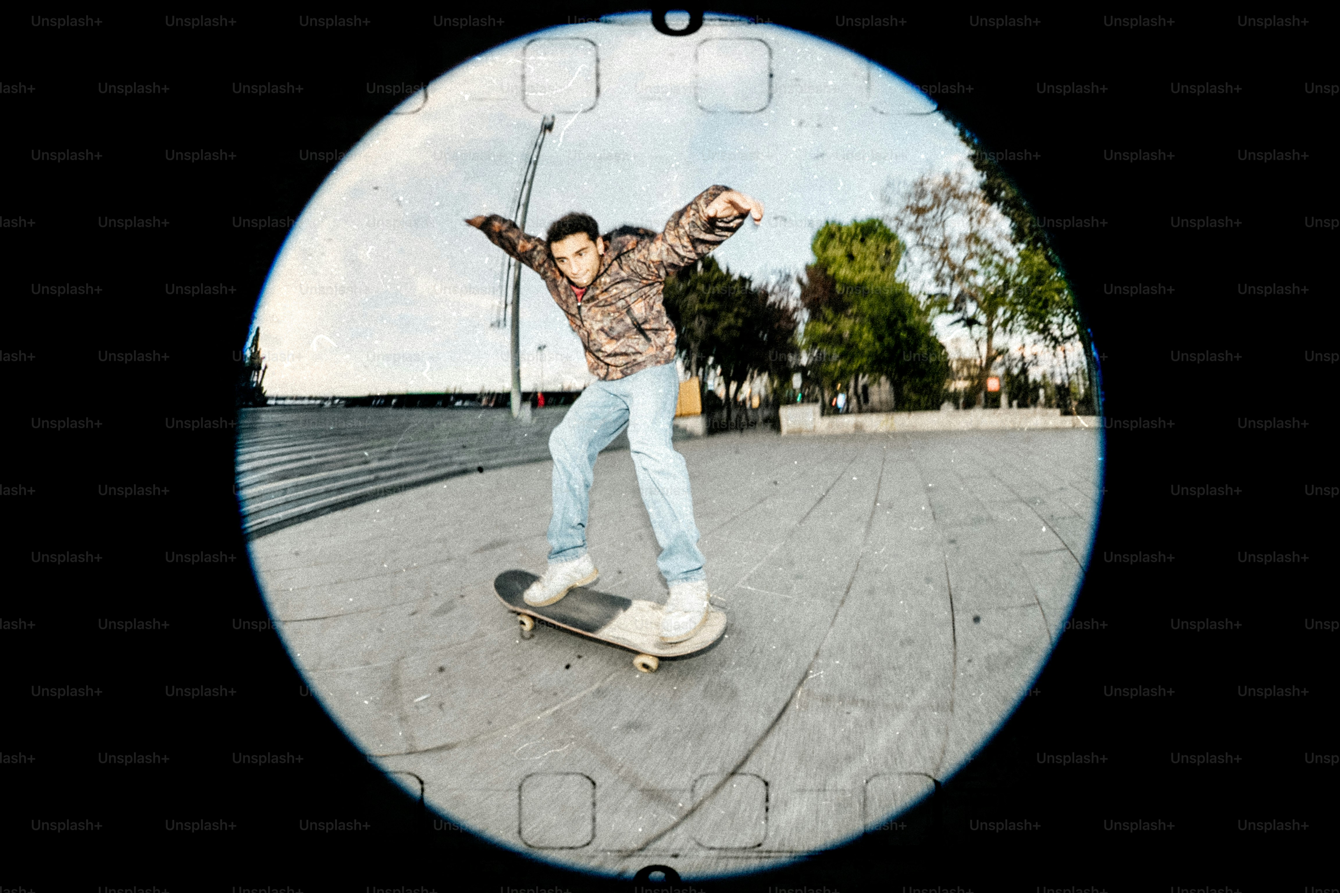 Young man skateboarding down a suburban street photo – Skateboard Image ...
