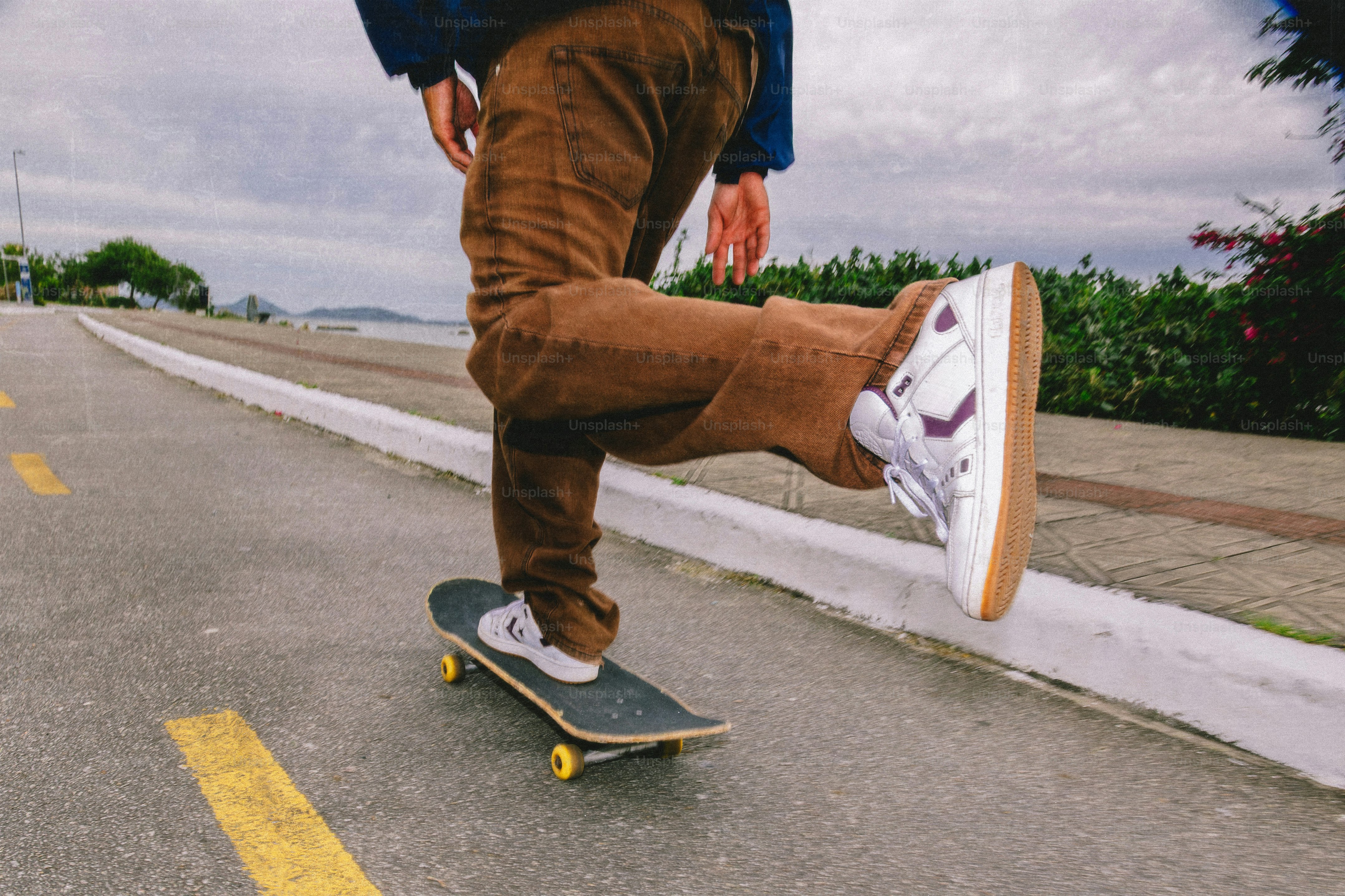 Person skateboarding on a paved road photo – Sport Image on Unsplash