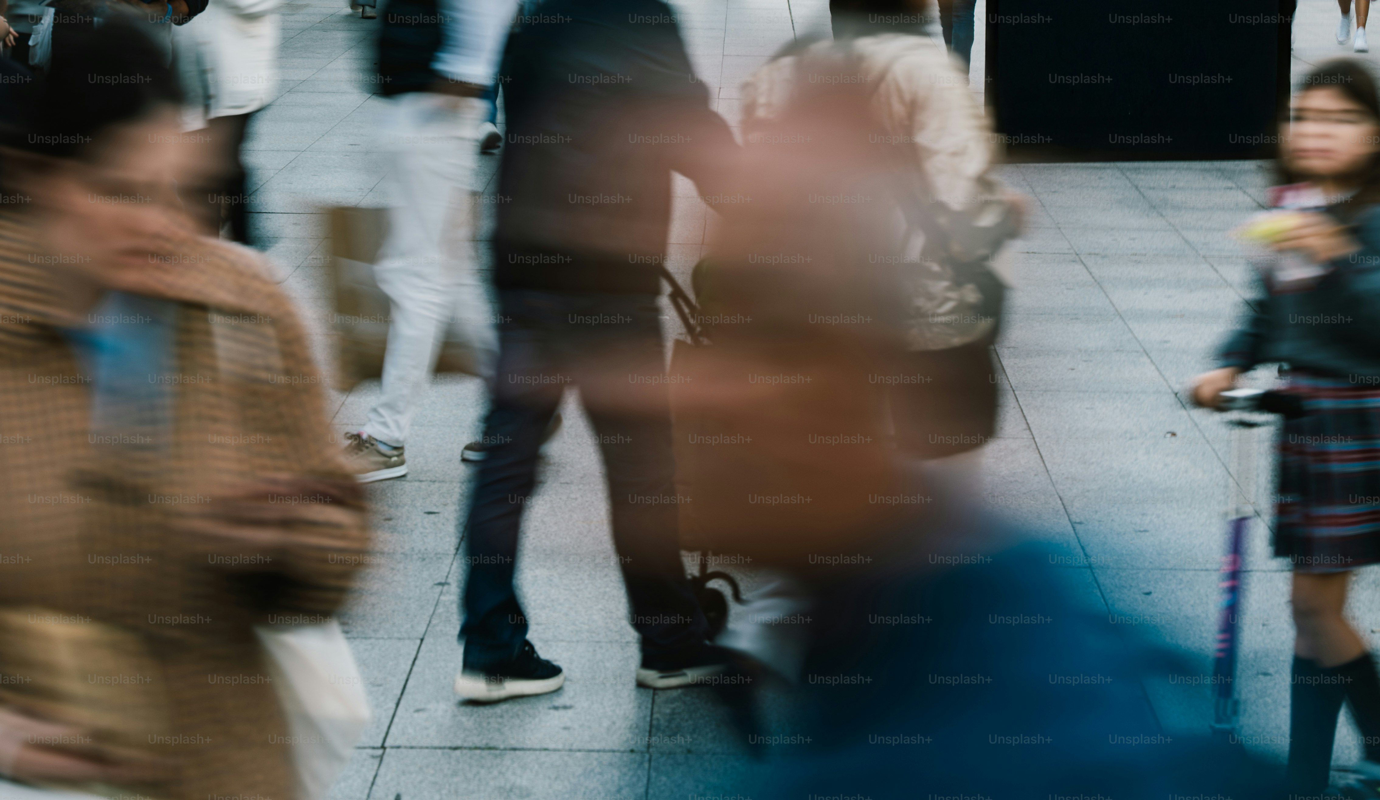 Blurred figures walking down a sunlit street photo – Walking Image on ...