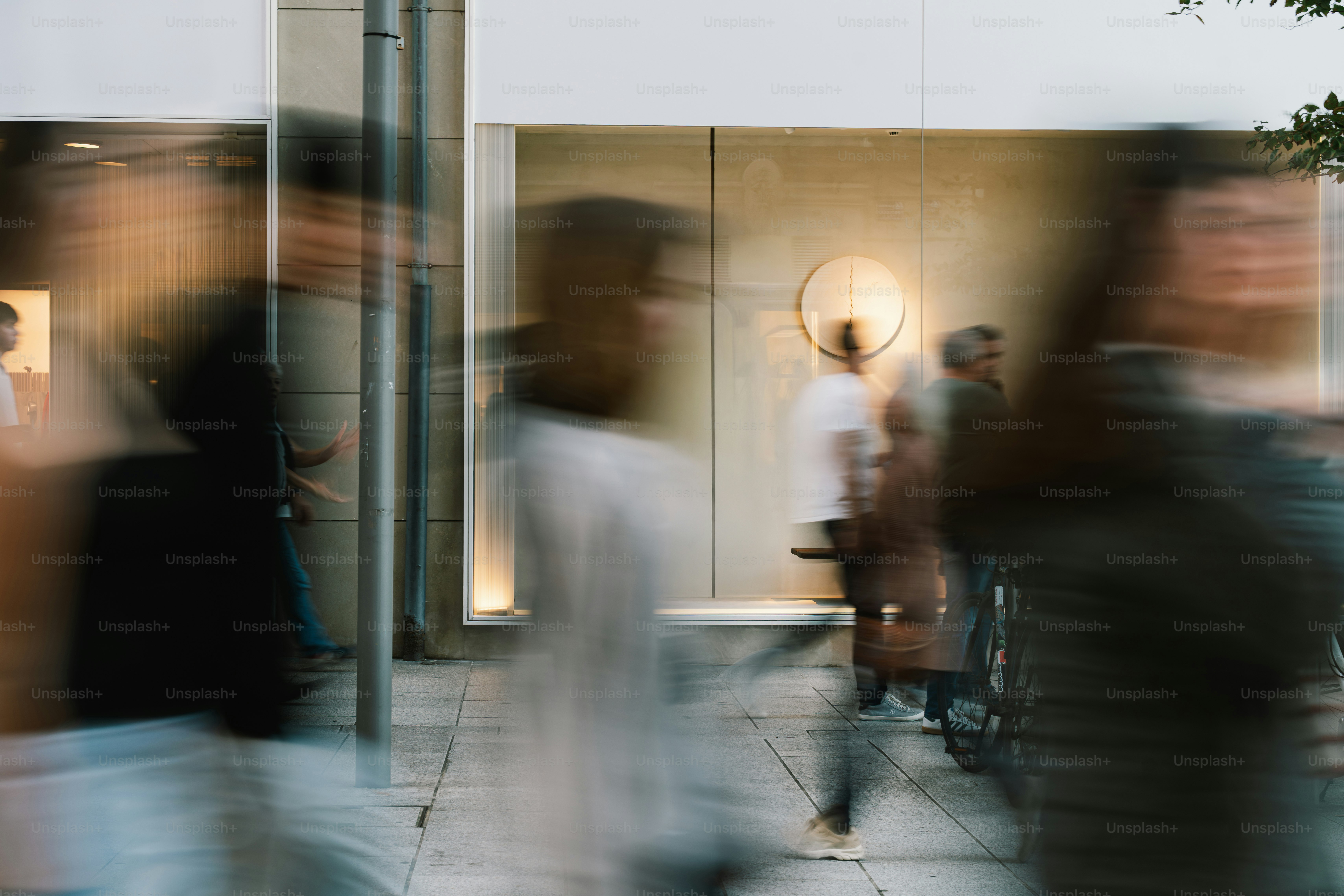 Blurred figures walking down a sunlit street photo – Walking Image on ...