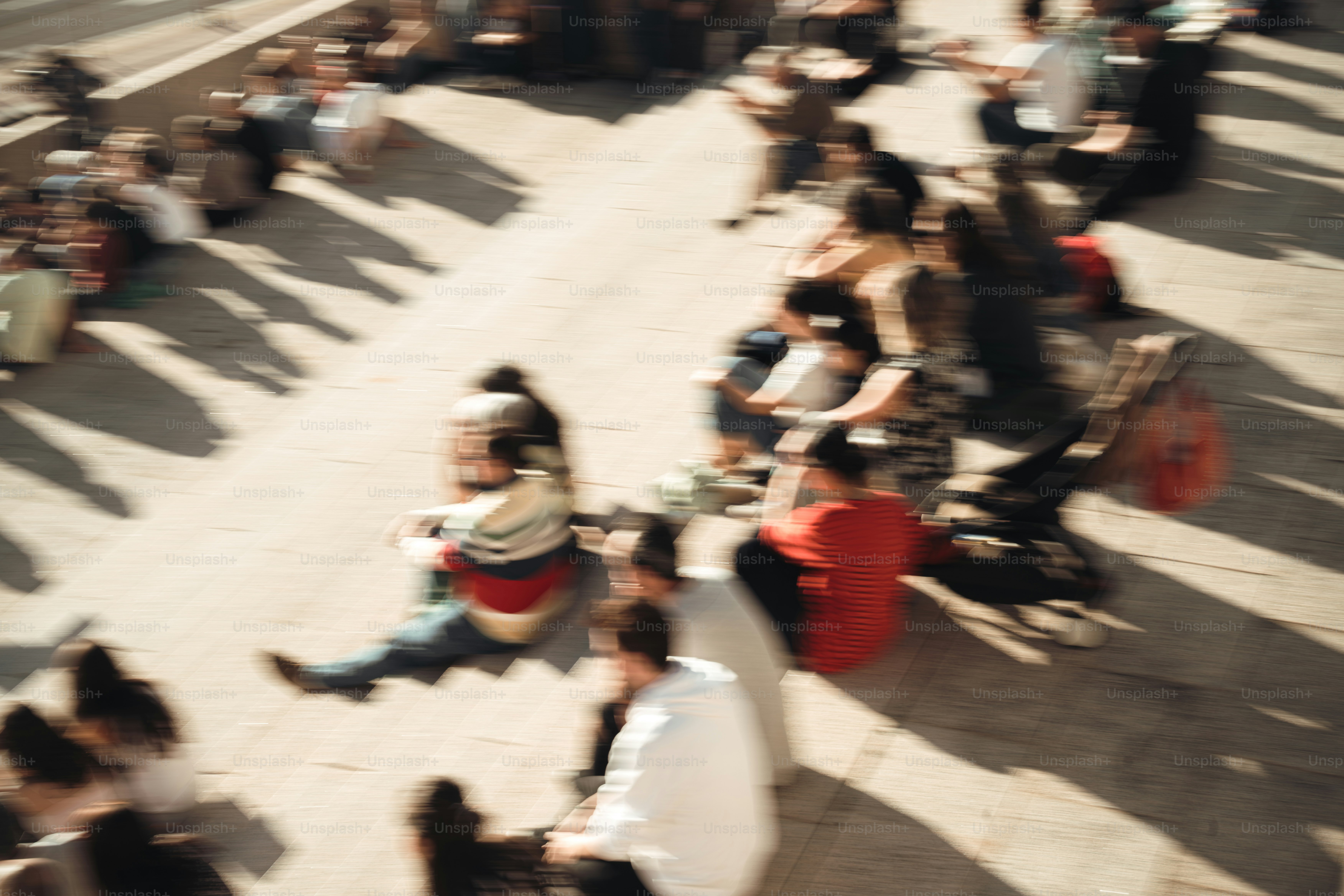 People sitting on outdoor stairs near a body of water. photo – People ...