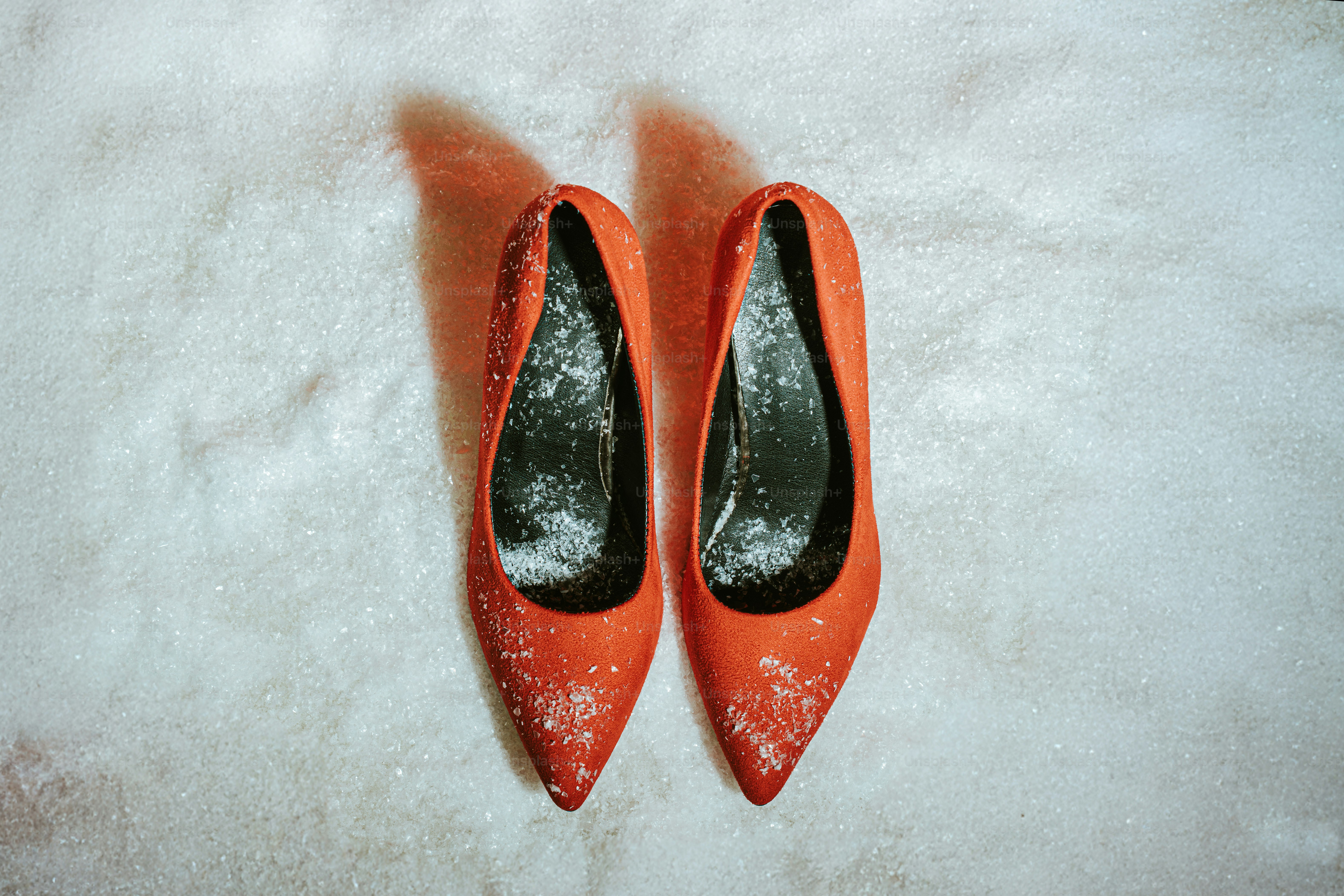 Pair of orange high heels covered in snow photo – Christmas Image on ...
