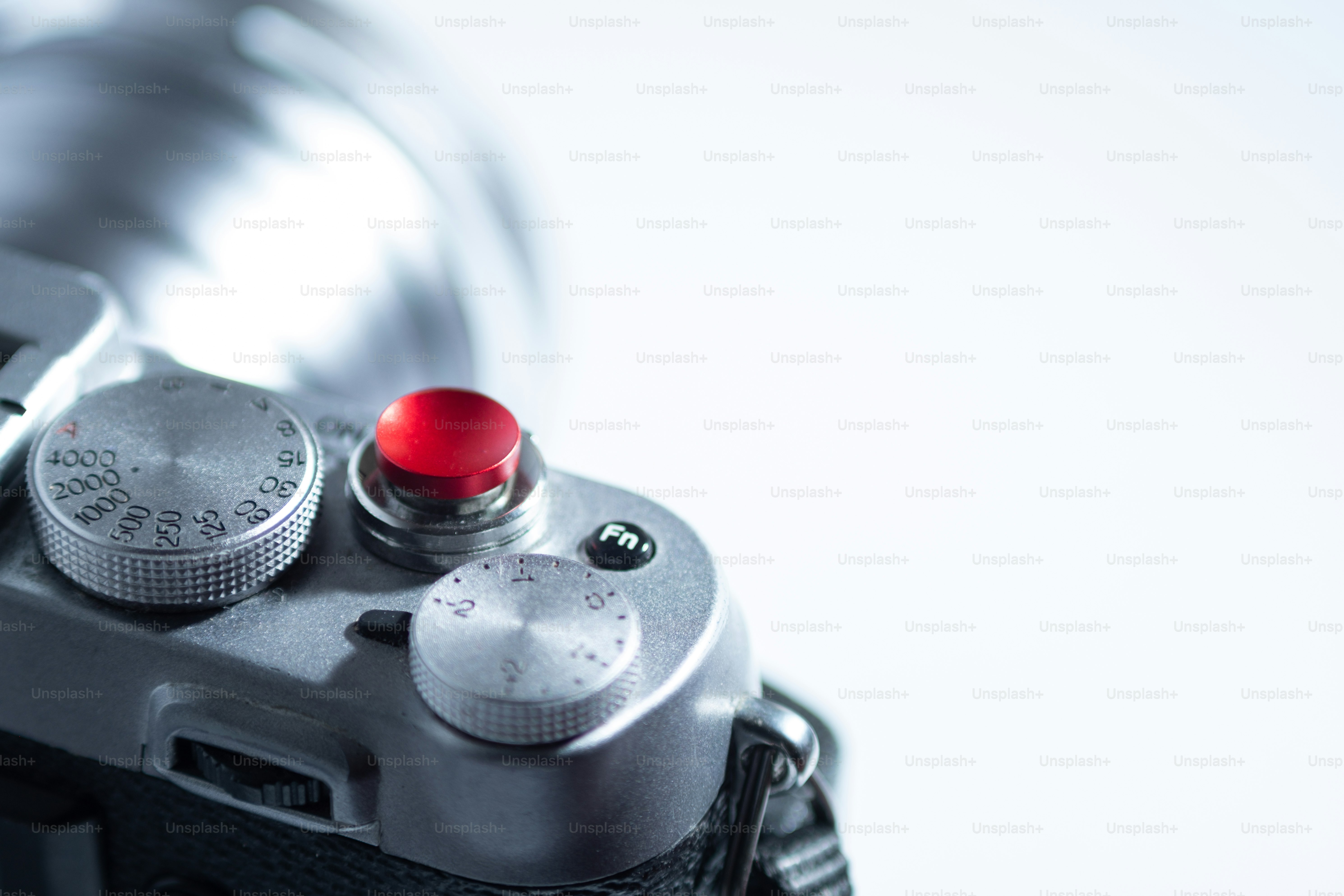 A small silver digital camera on a white background photo – Technology ...