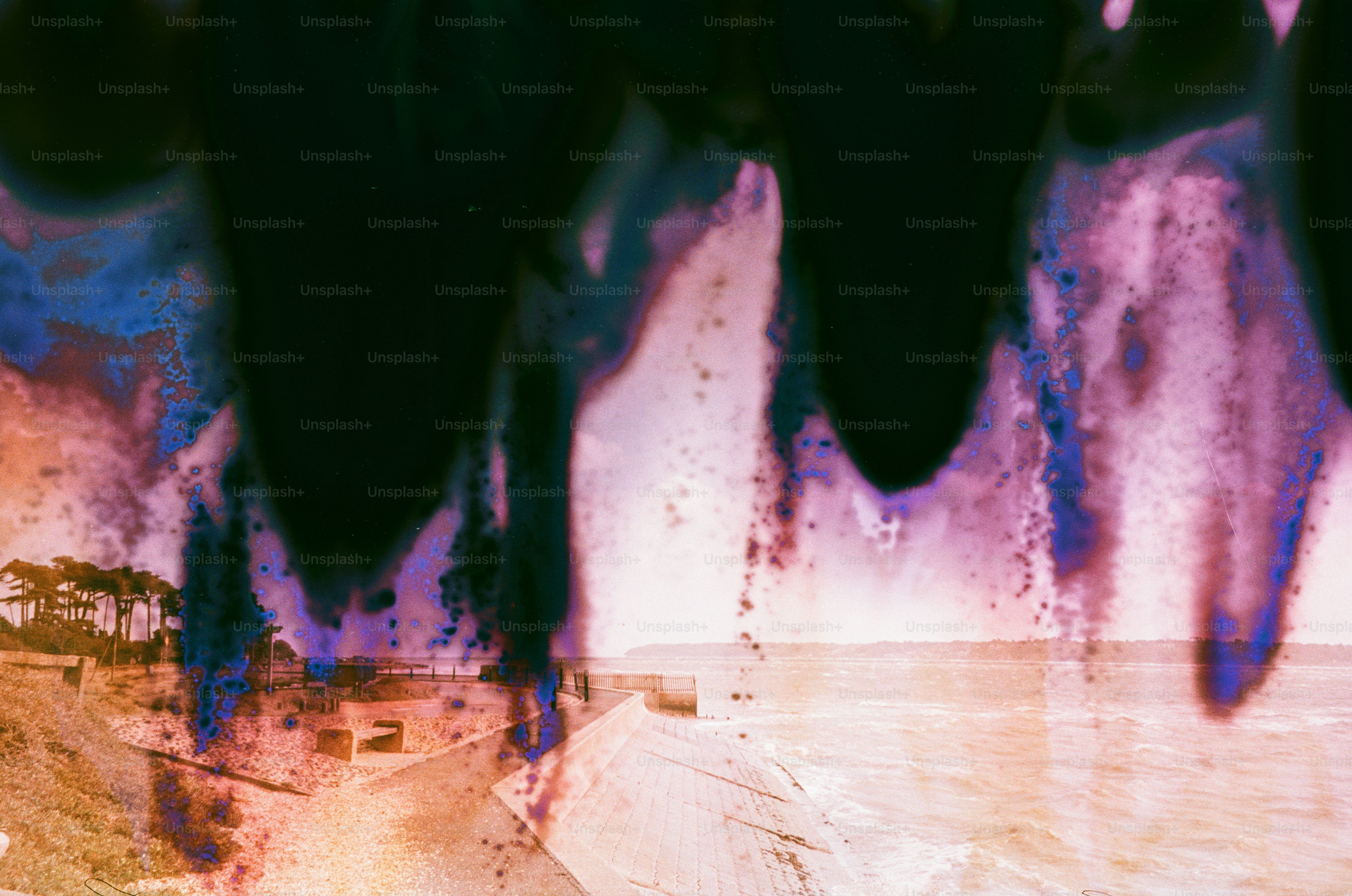 Abstract colorful streaks over a blurry landscape photo – Film ...