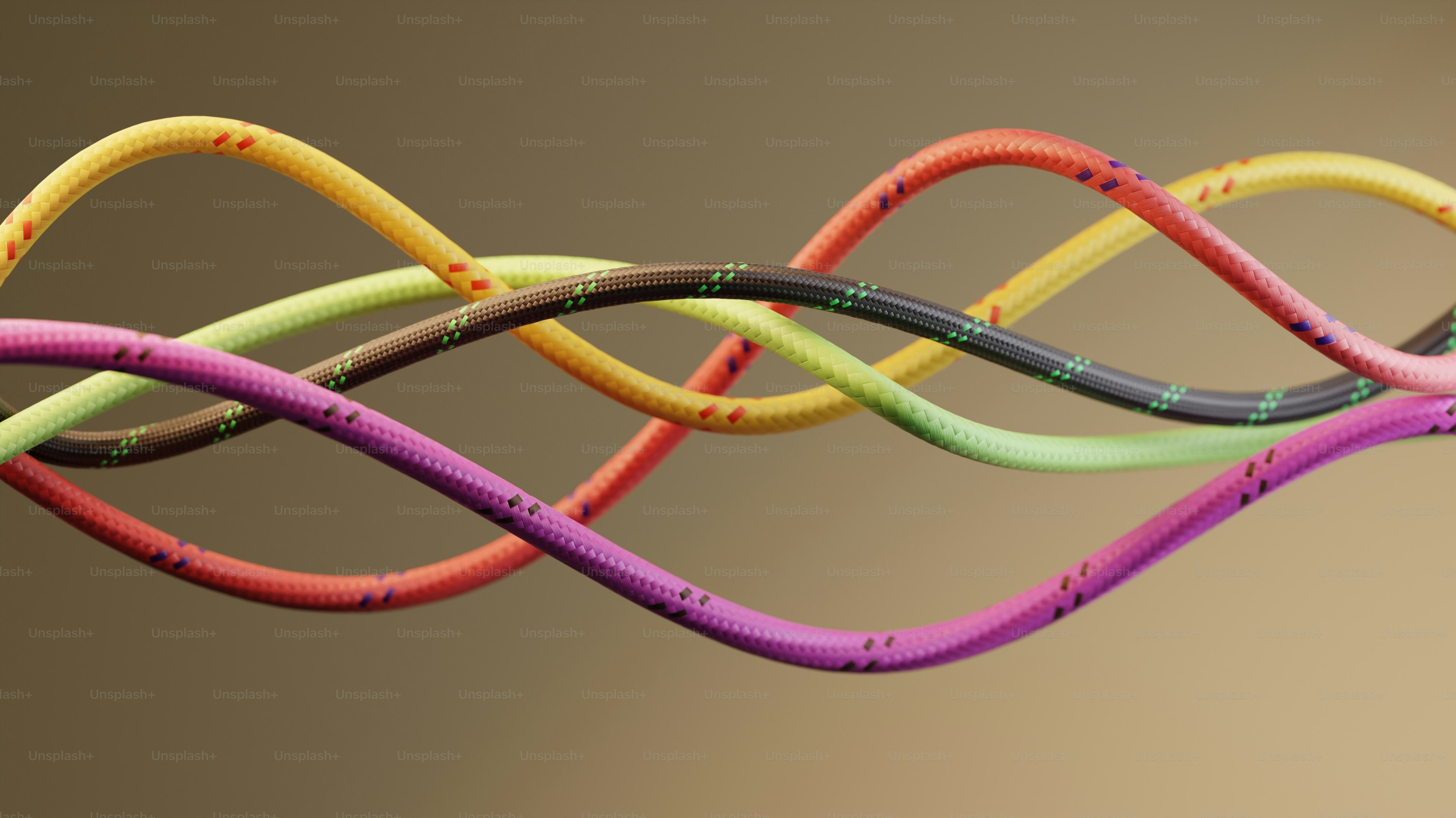 Colorful intertwined cables on a brown background photo – Background ...