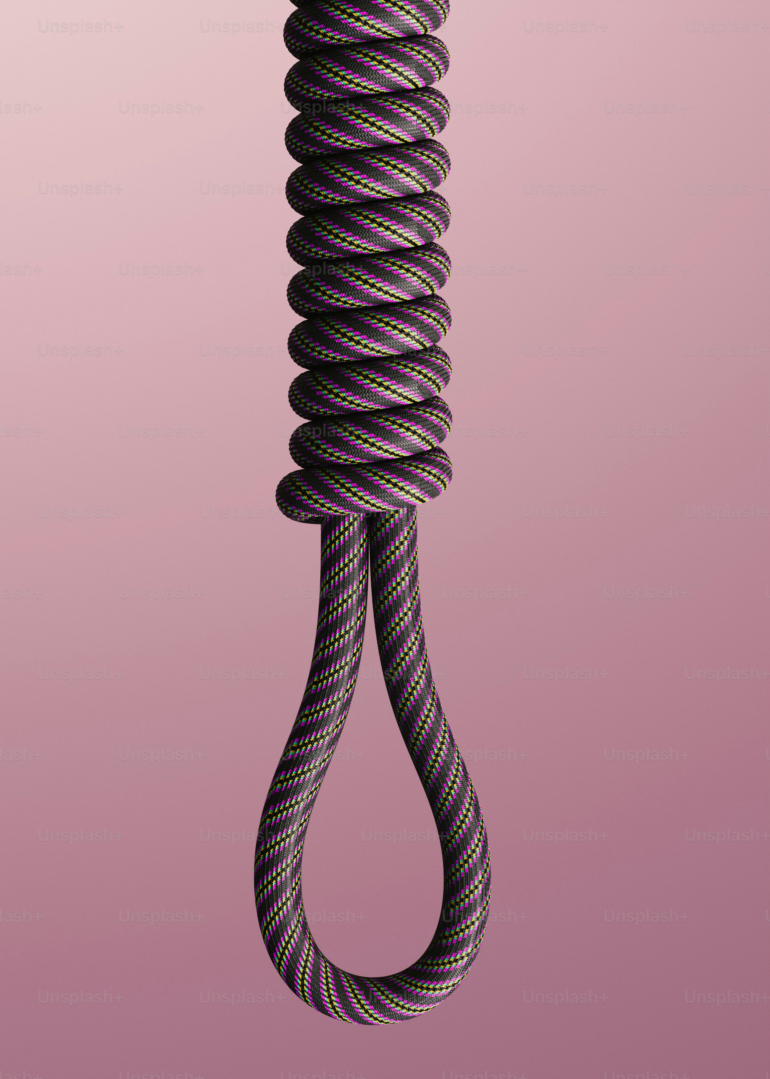 A noose made of striped rope on pink background photo – 3d render Image ...