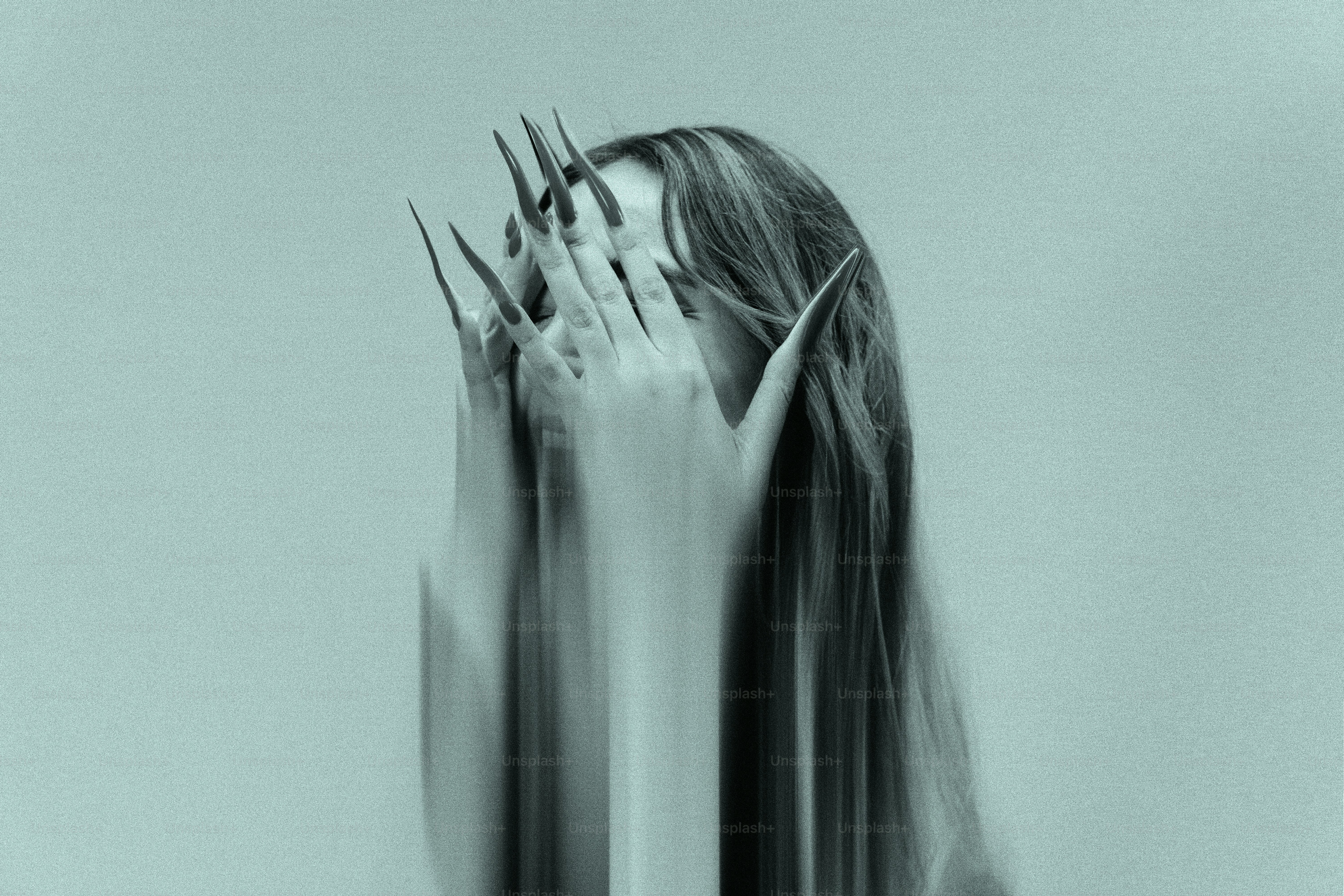Woman with long claws covers face with hands. photo – Hair Image on ...