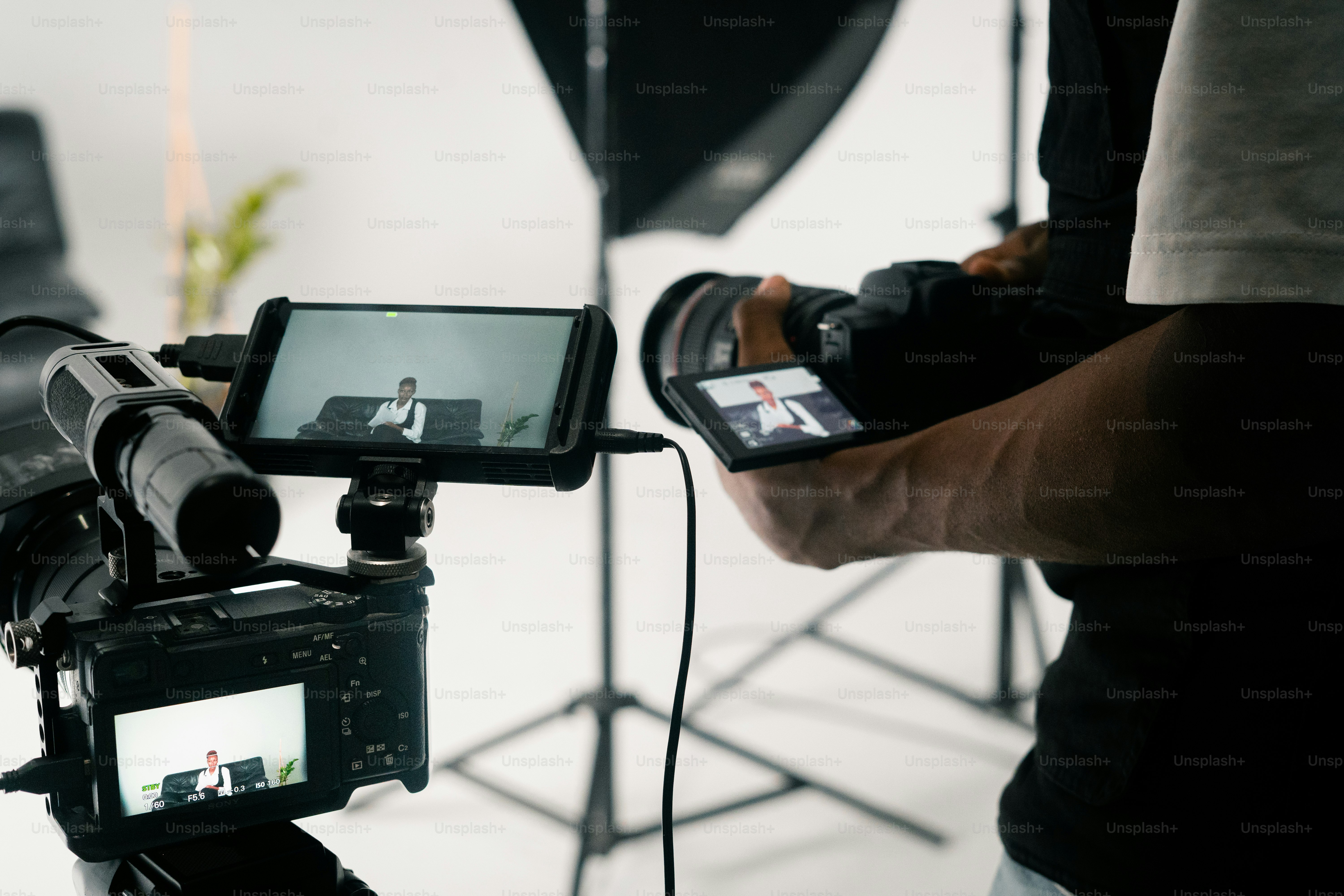 Filming a person in a studio with professional equipment. photo ...