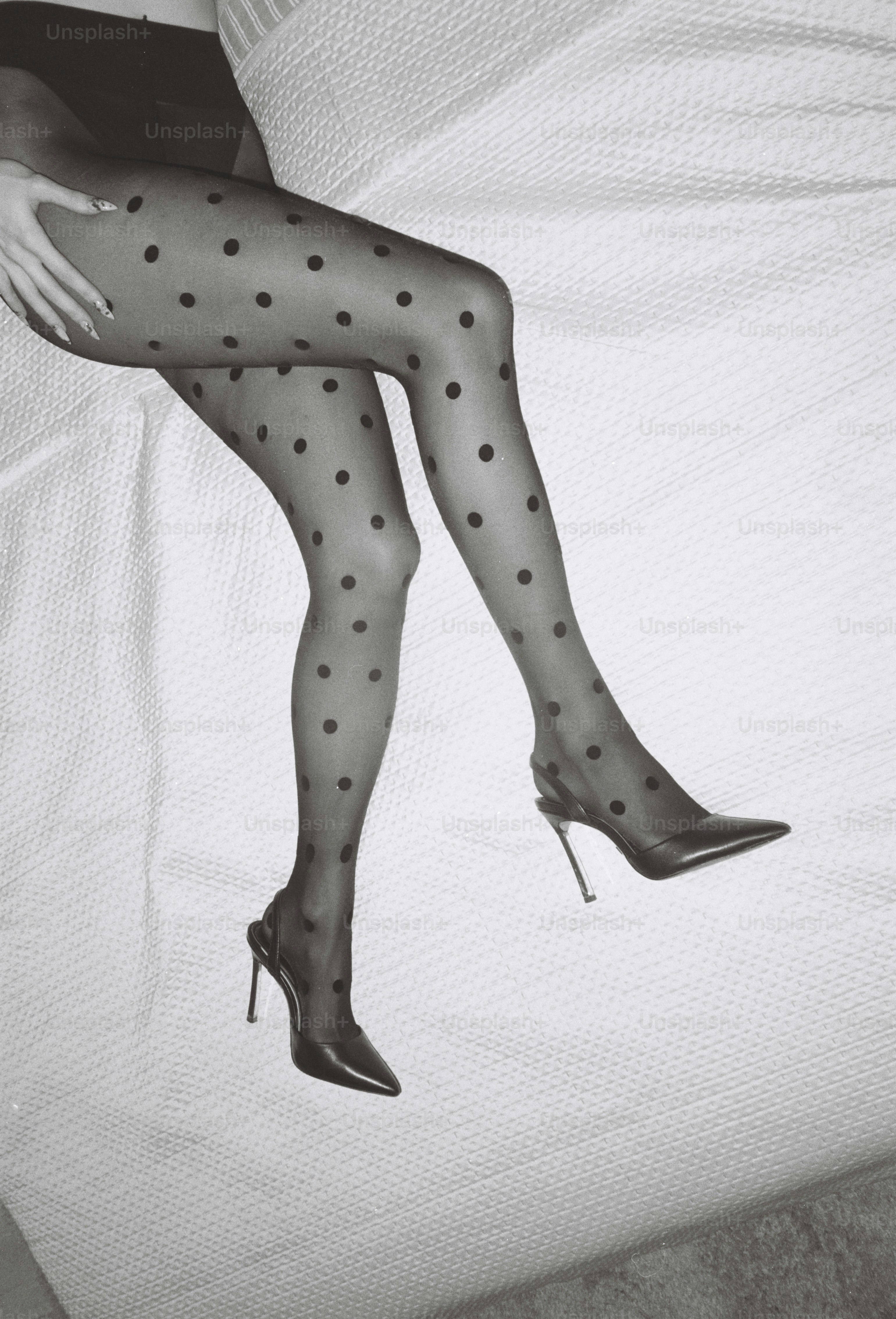 Woman's legs wearing sheer polka dot stockings photo – Pattern Image on ...