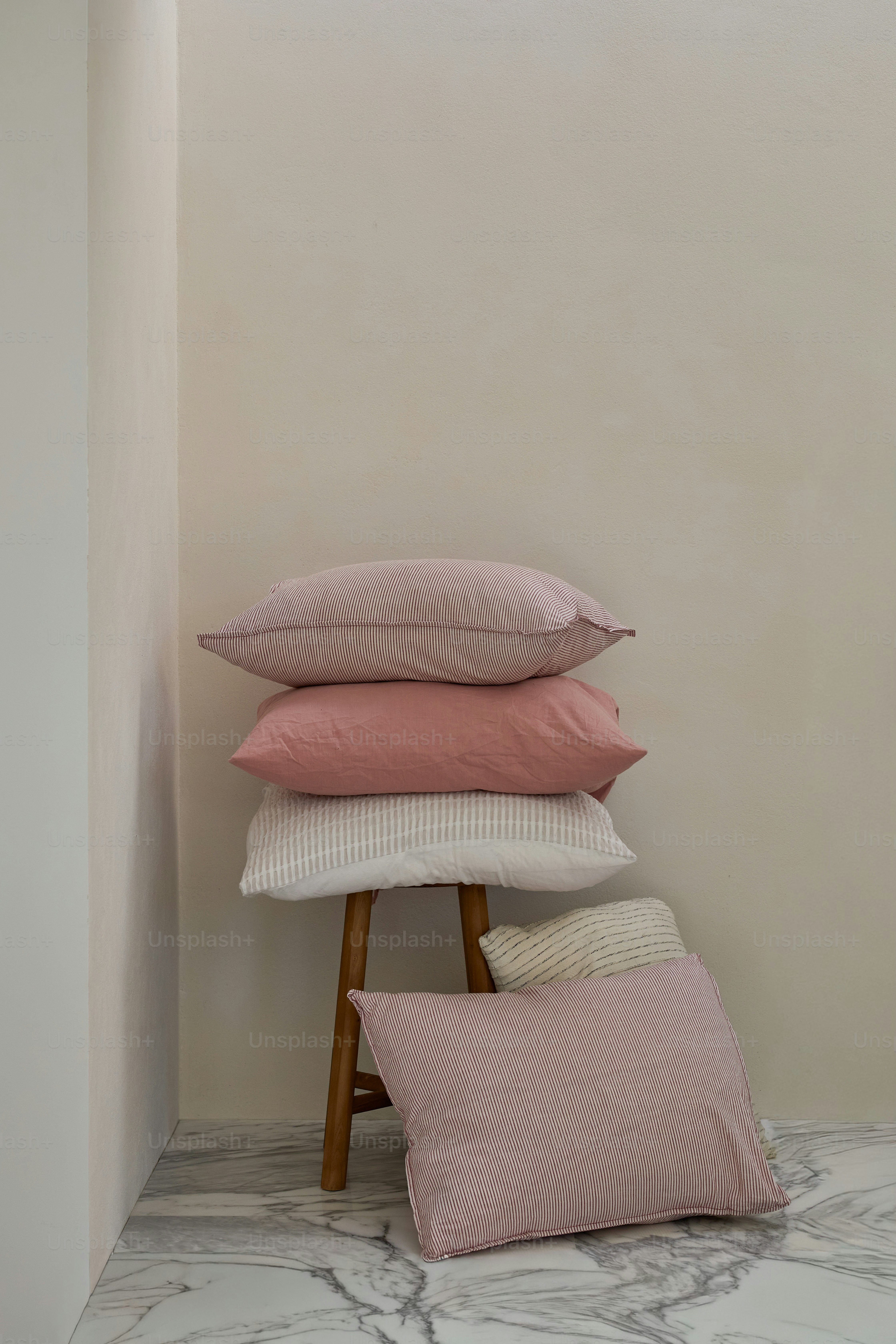Person holding a stack of four pillows photo – Interior design Image on ...