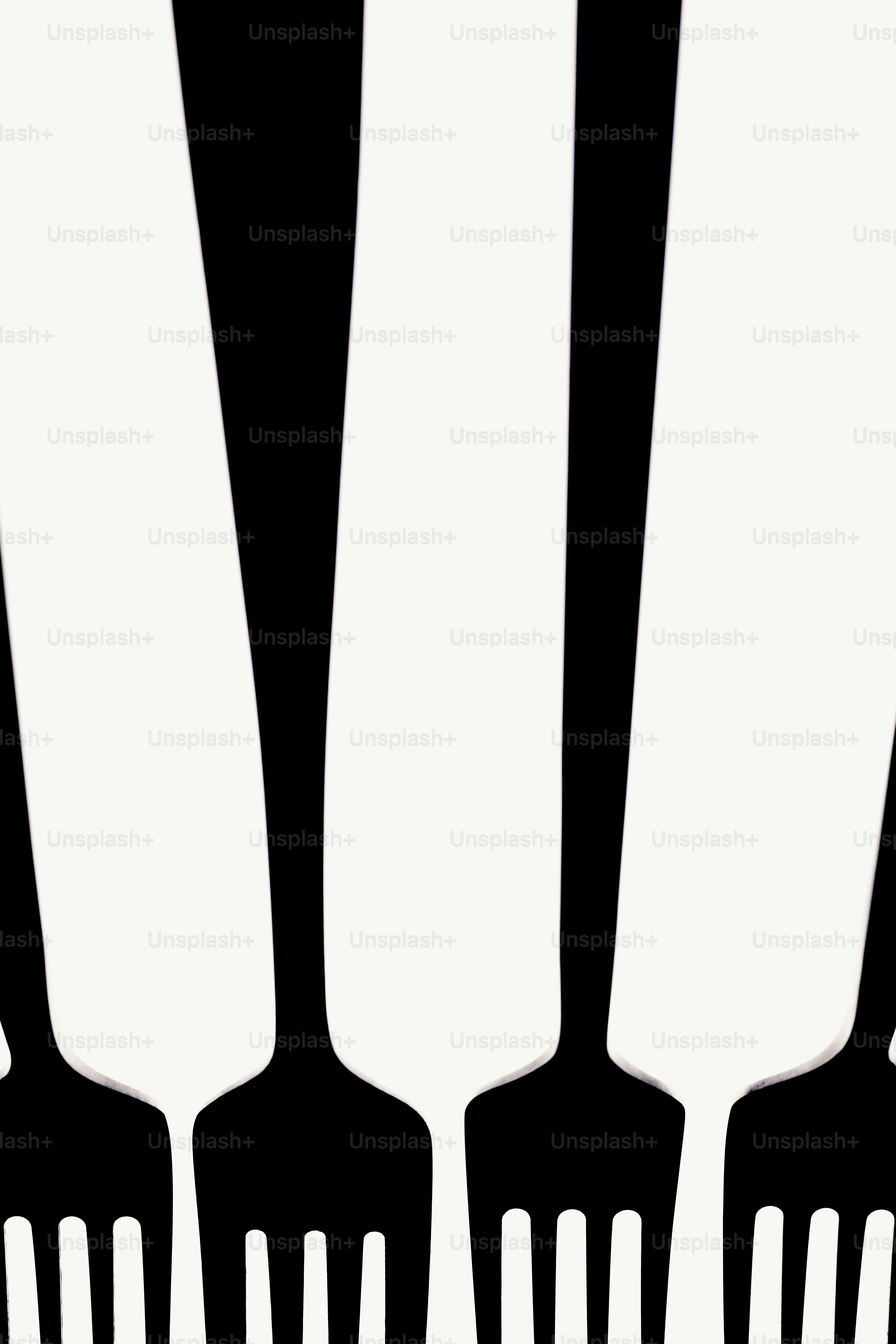 Four forks silhouetted against a black background photo – Texture Image ...