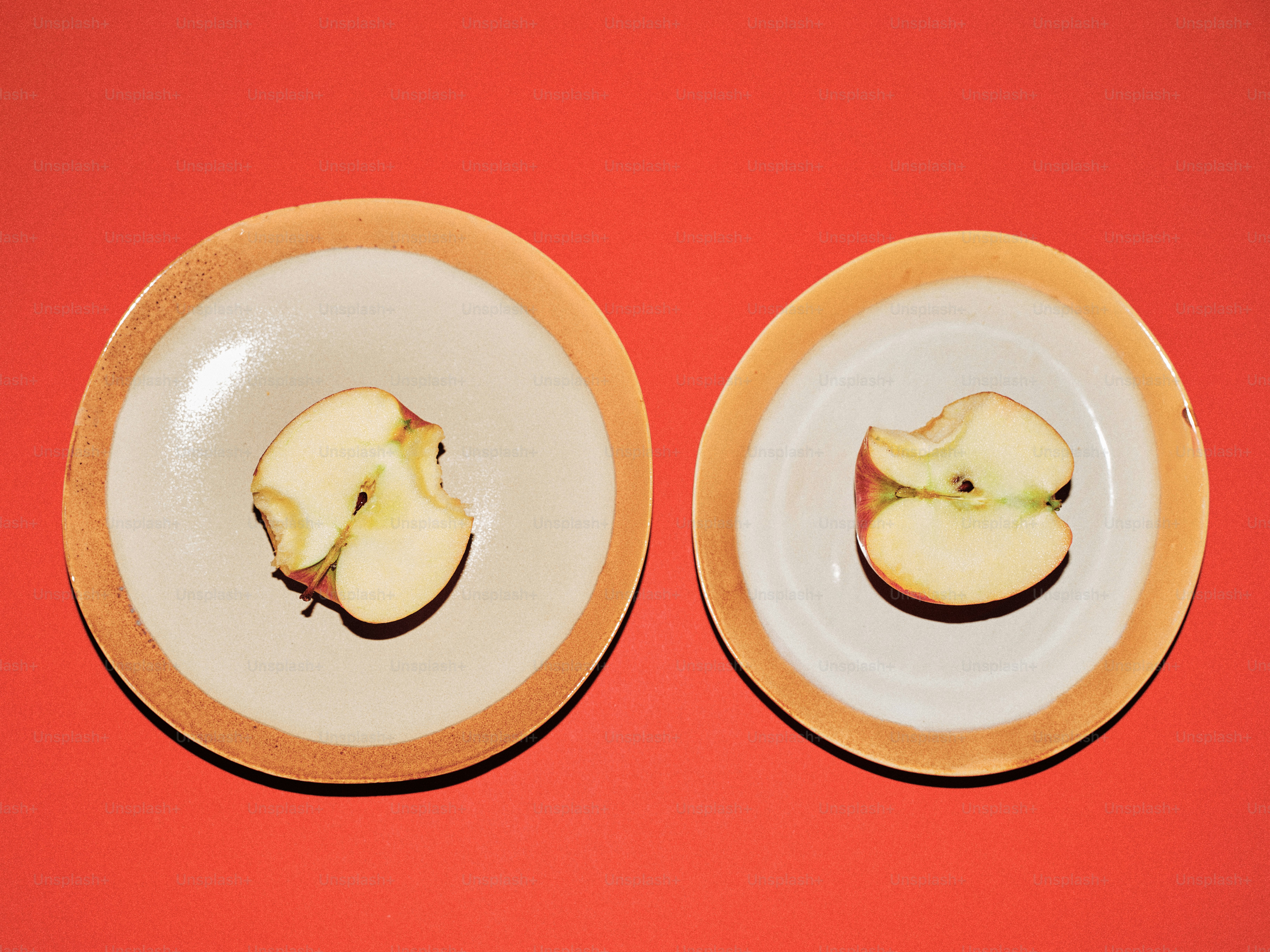 Two apple slices on small plates photo – Financial Image on Unsplash