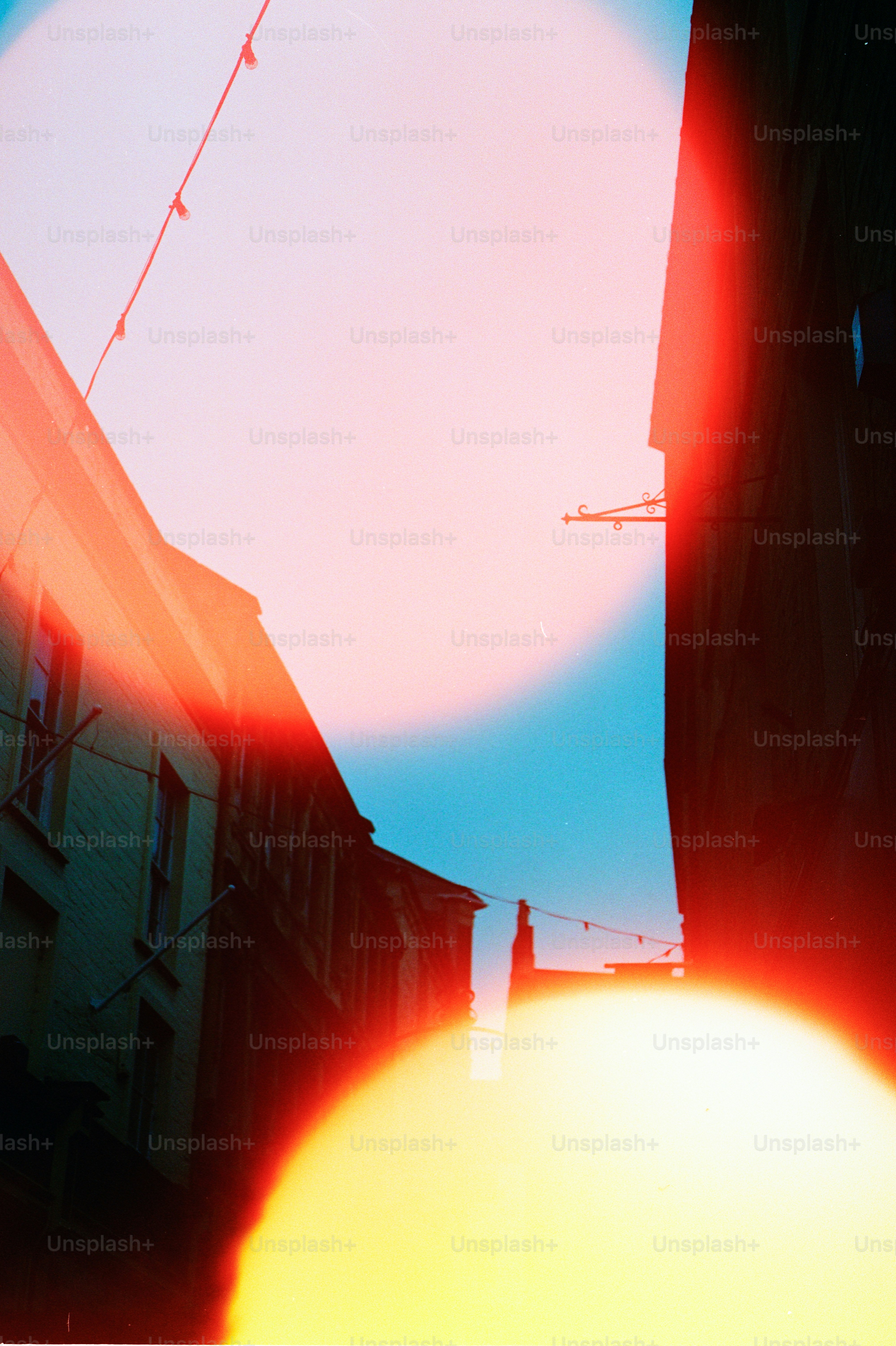 Street scene with large colorful lens flares photo – Creative Image on ...
