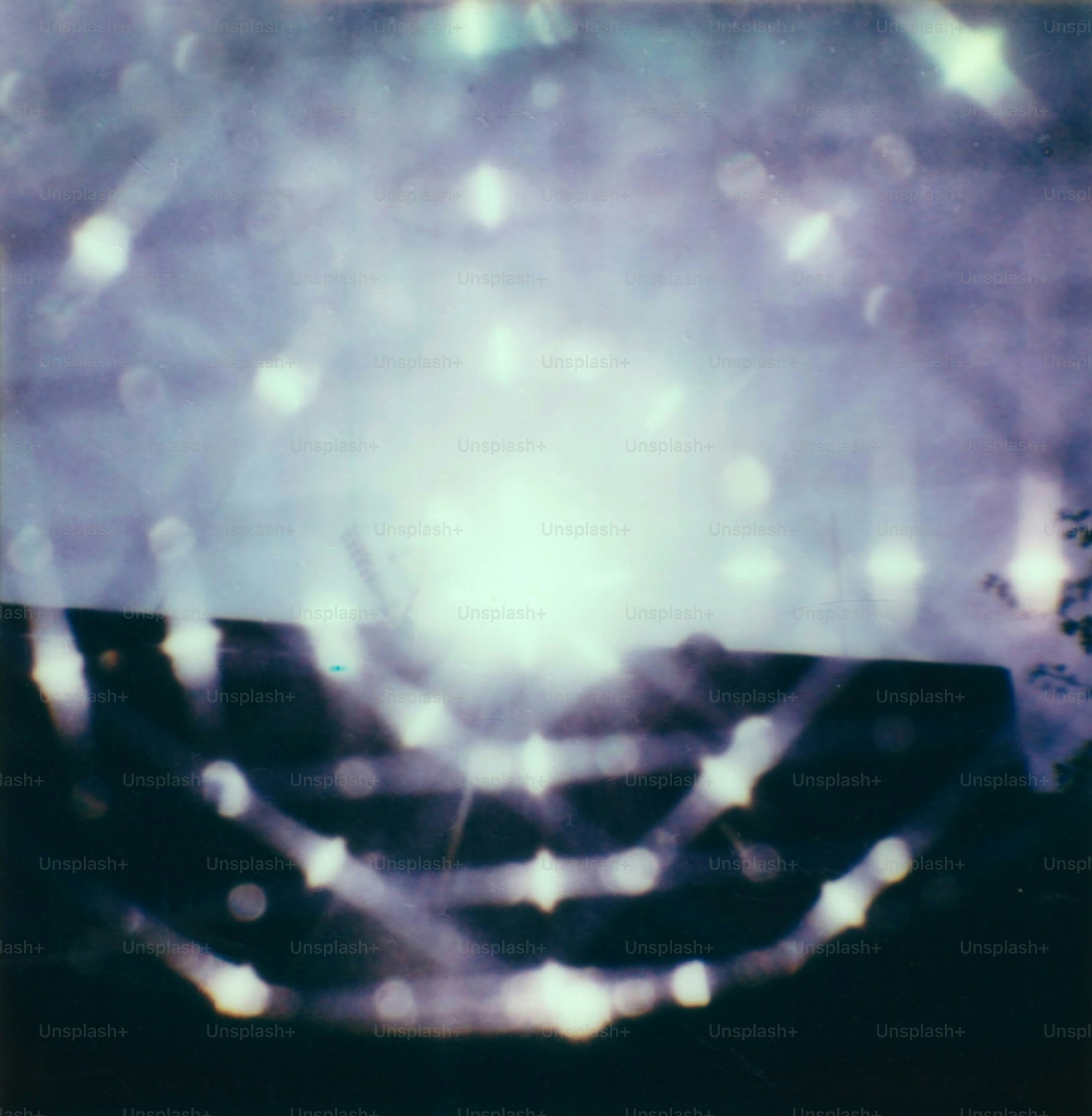 Blurred festive lights create a magical bokeh effect. photo – Abstract Image on Unsplash