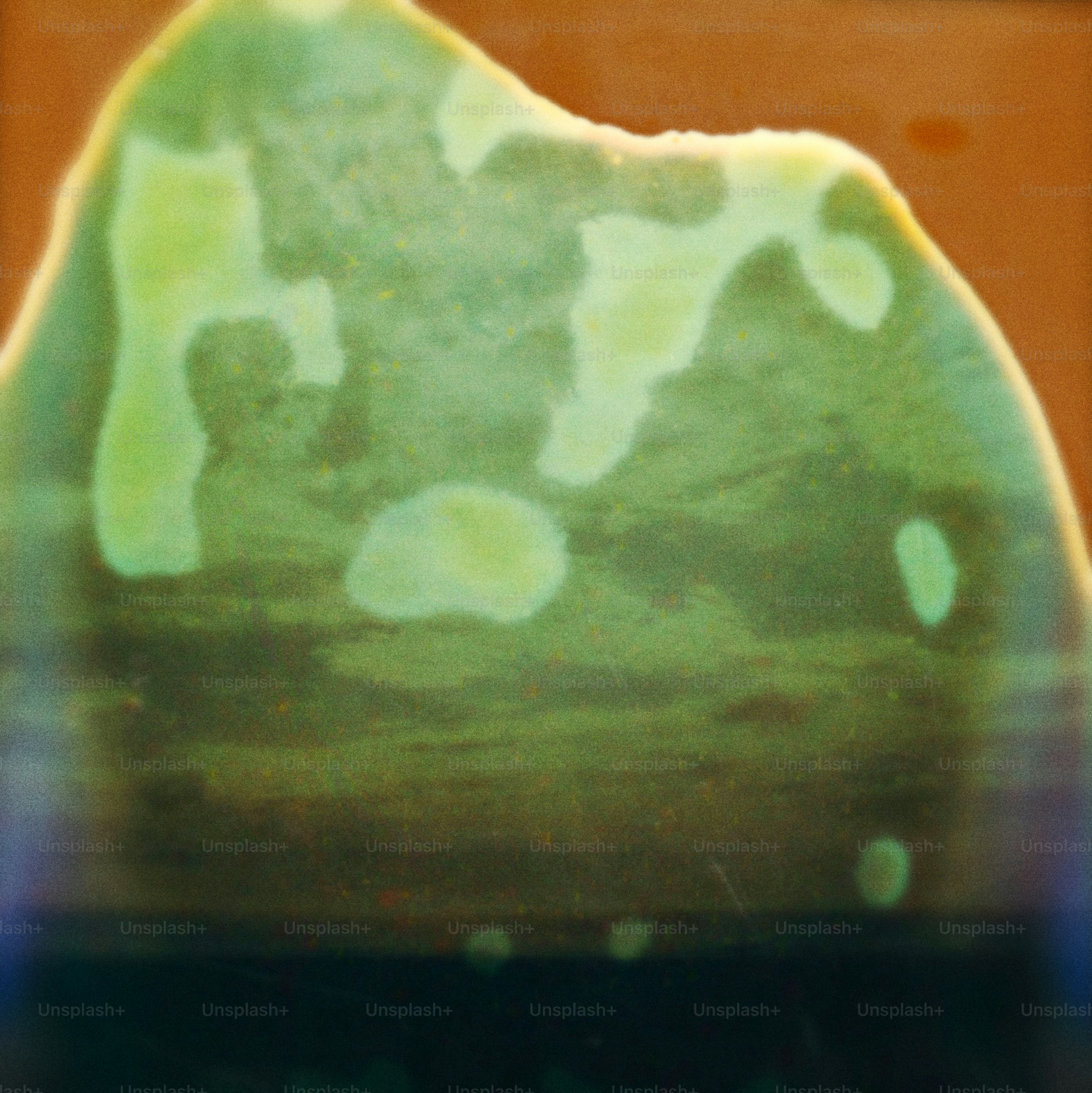 Abstract light streaks over a blurry landscape and water. photo ...