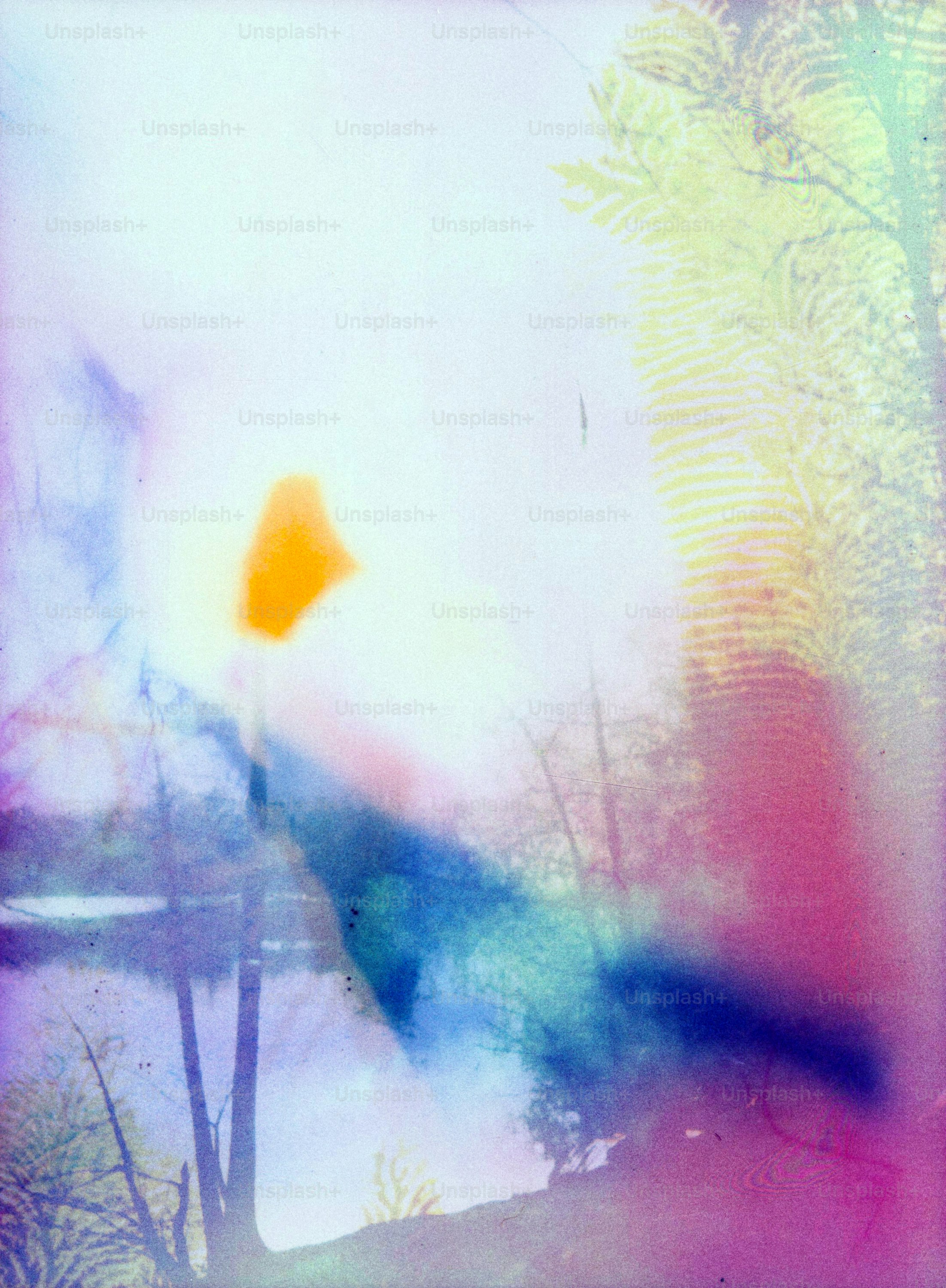 Abstract light streaks over a blurry landscape and water. photo ...