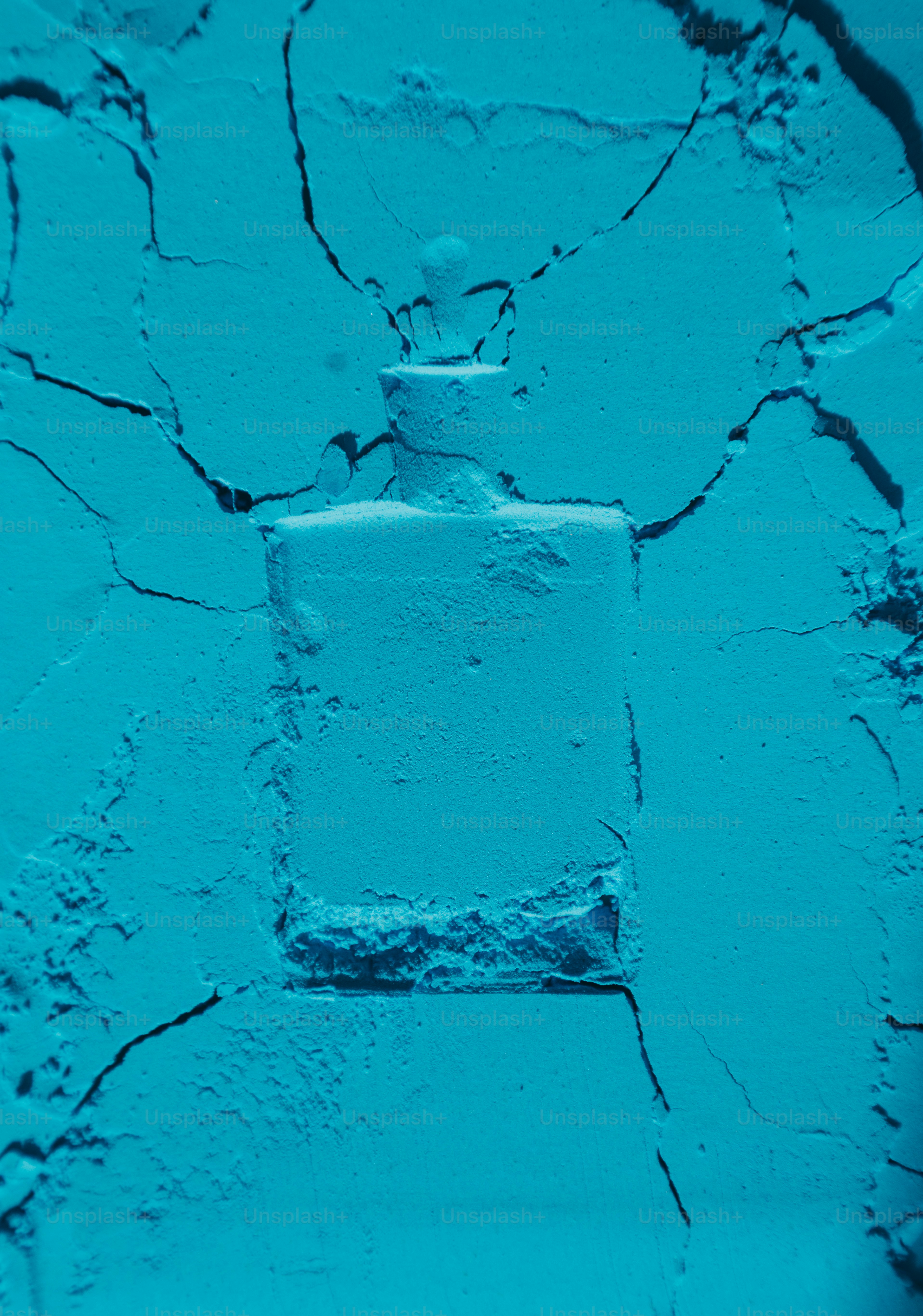 A bottle shape pressed into cyan powder photo – Texture Image on Unsplash