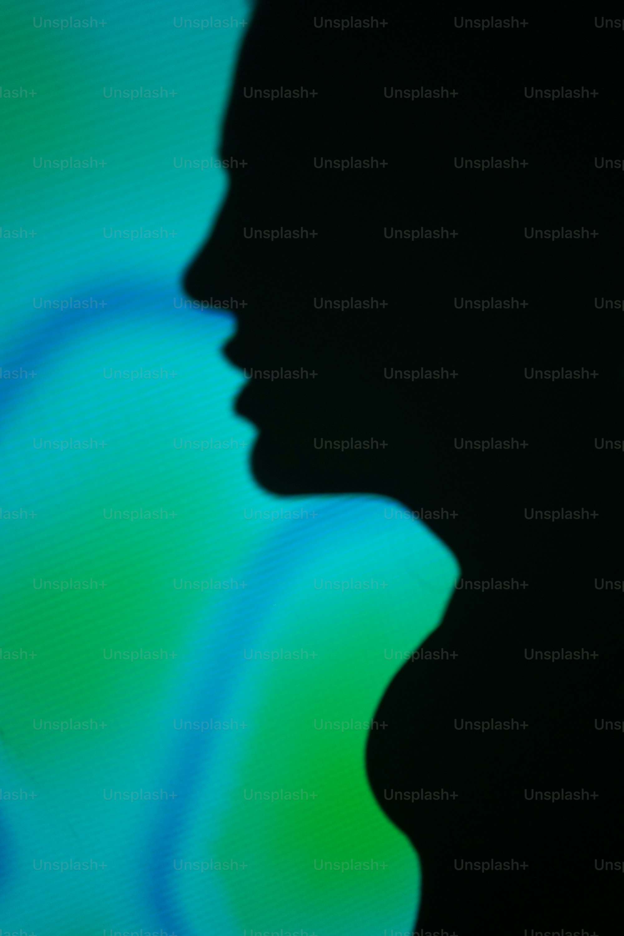 Silhouette of a hand reaching out against blue background photo ...