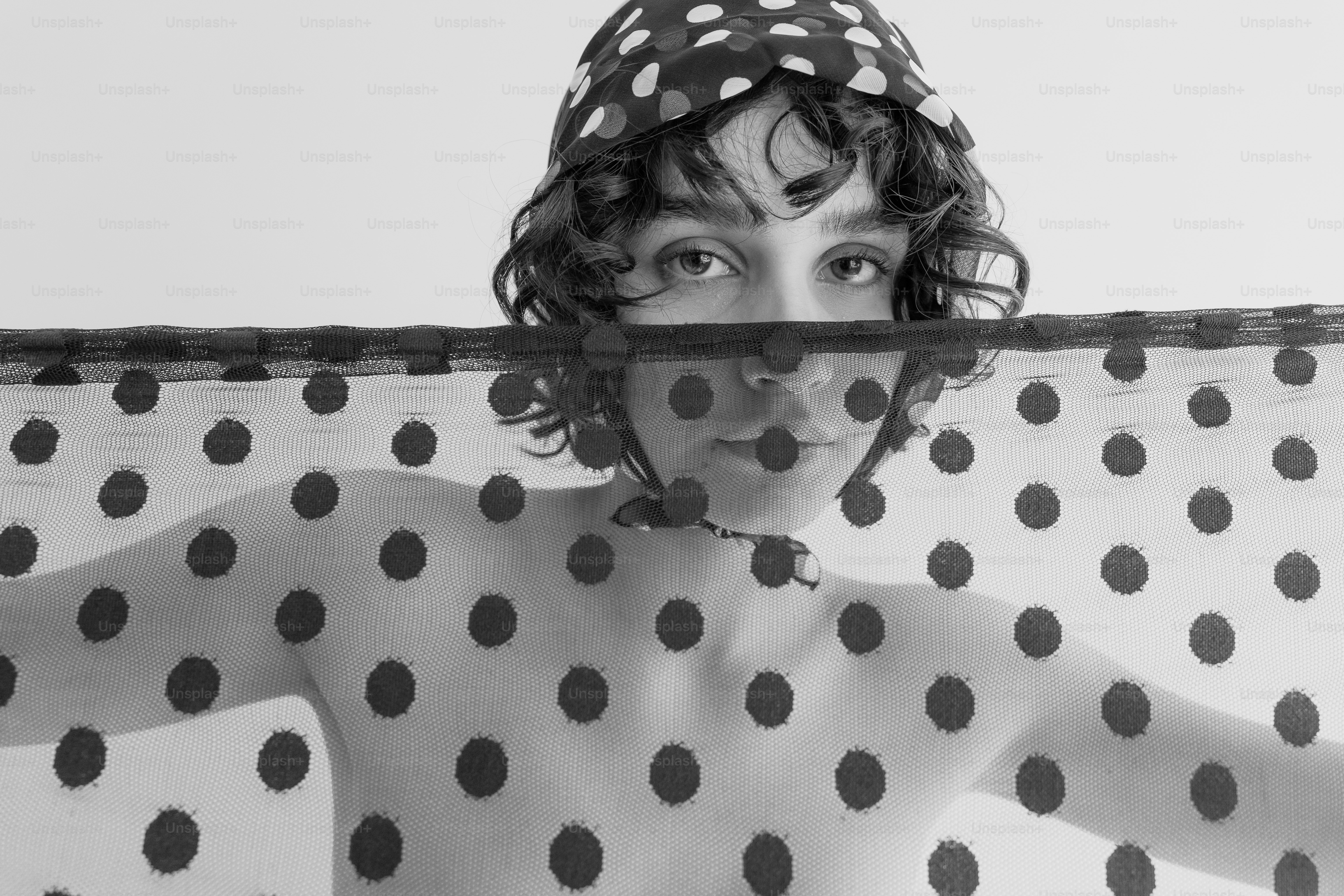 Woman with bandana and polka dot top photo – Yellow background Image on ...