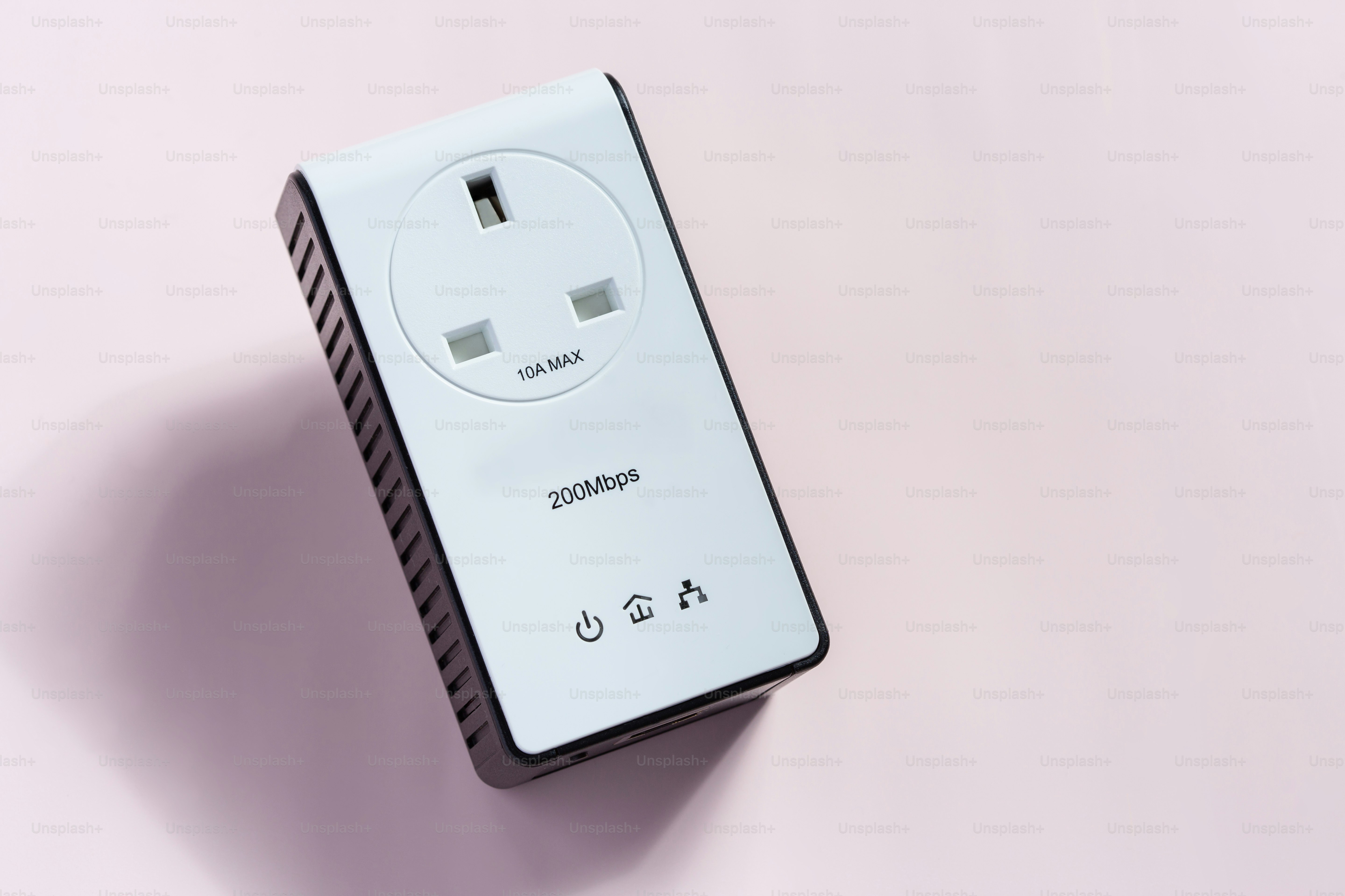 White powerline adapter with uk plug on pink background photo – Technology Image on Unsplash