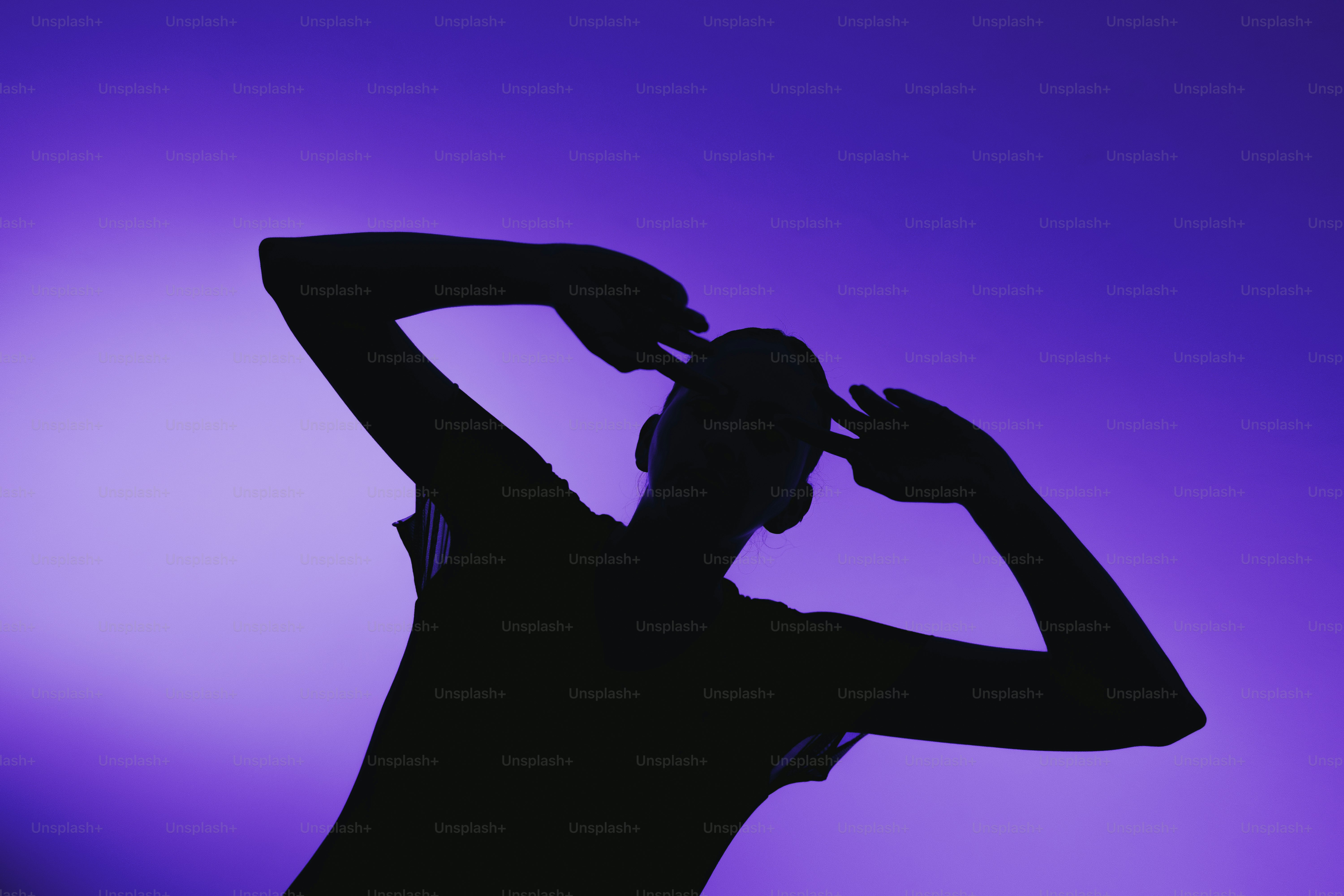 Silhouette of a dancer against a purple background photo – Profile ...
