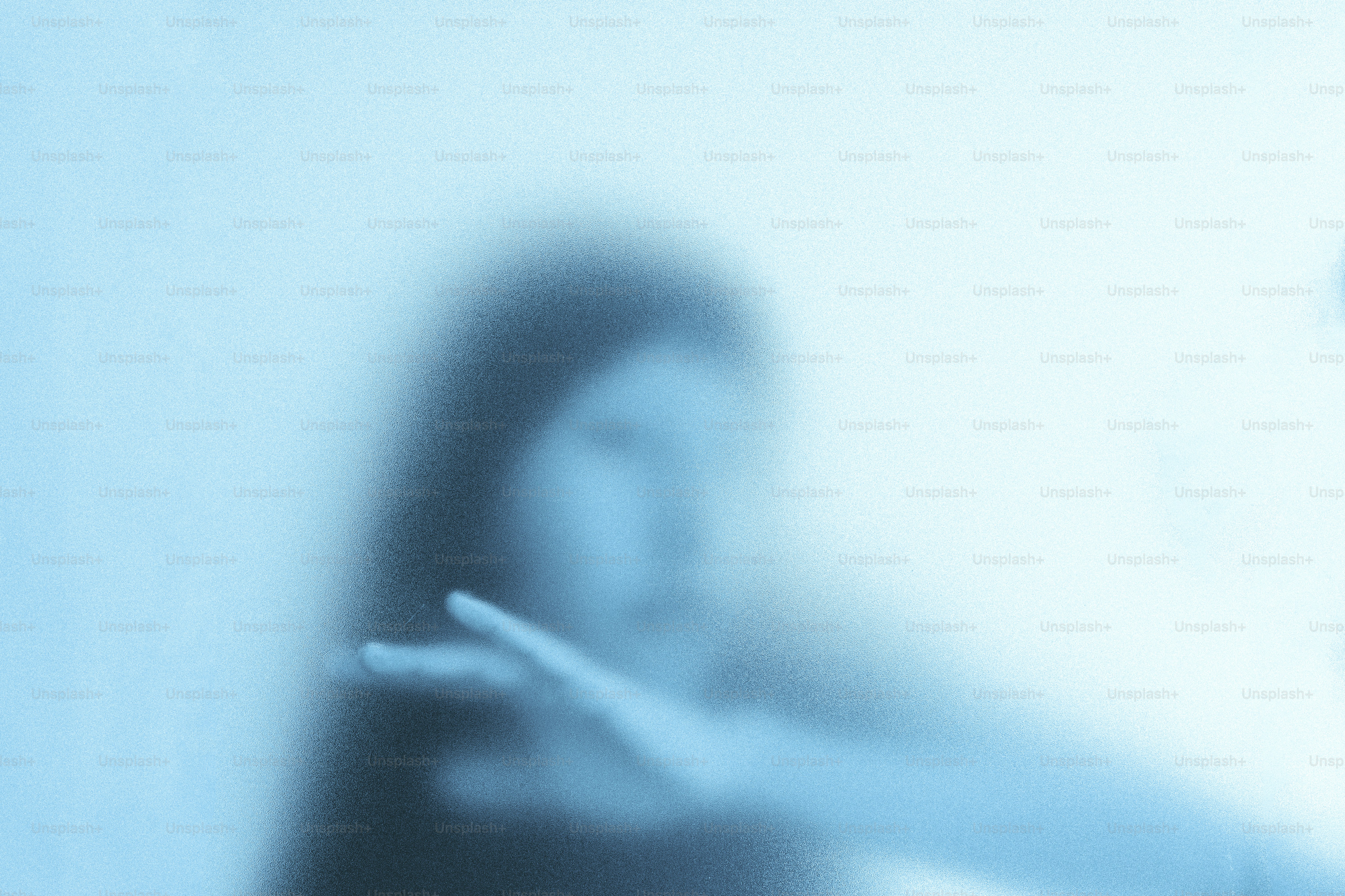 Blurred figure behind frosted glass with blue light. photo – Silhouette ...